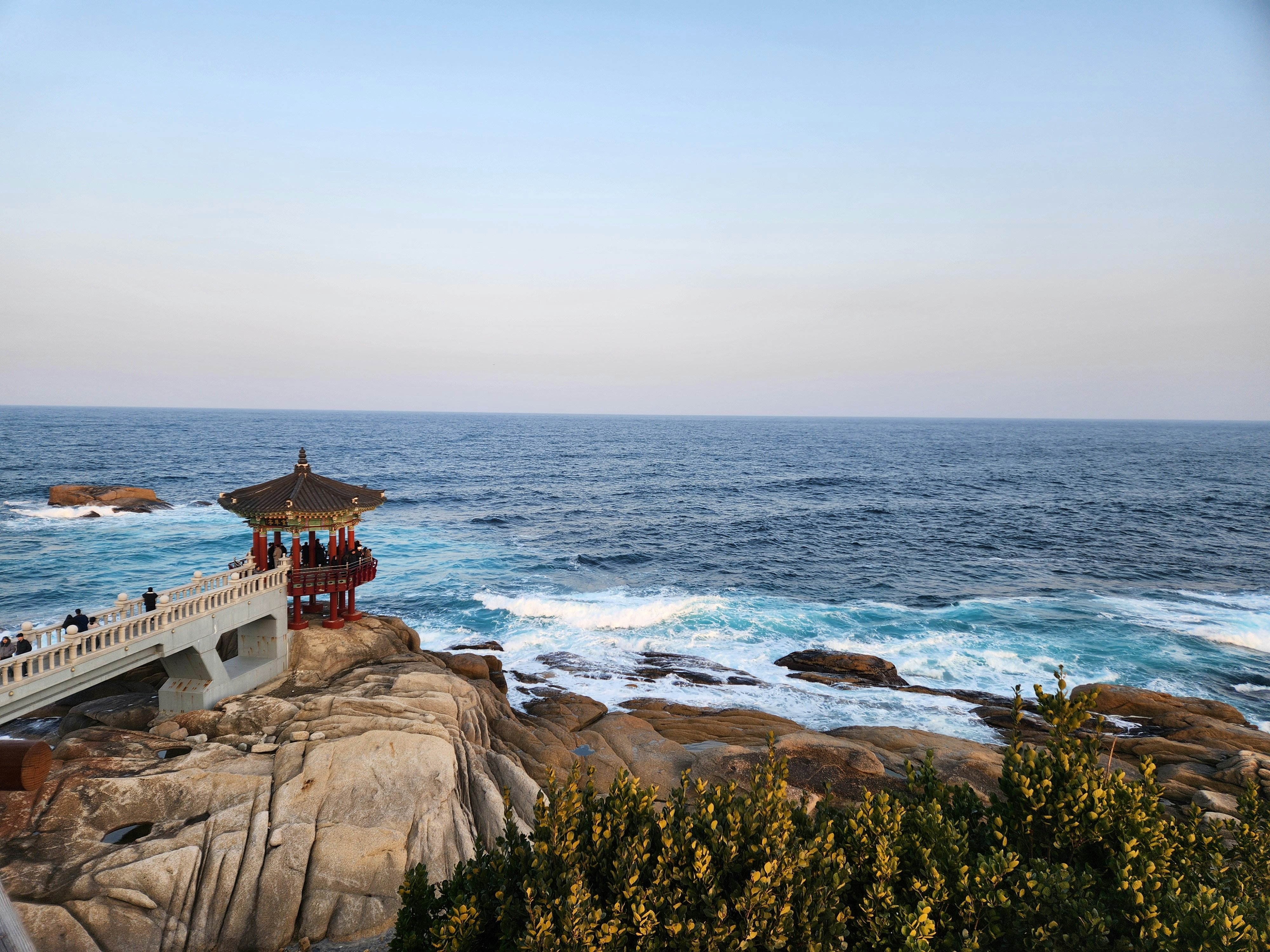Sunlit Pavilion Over the Sea: A Coastal Grotto on the rocks