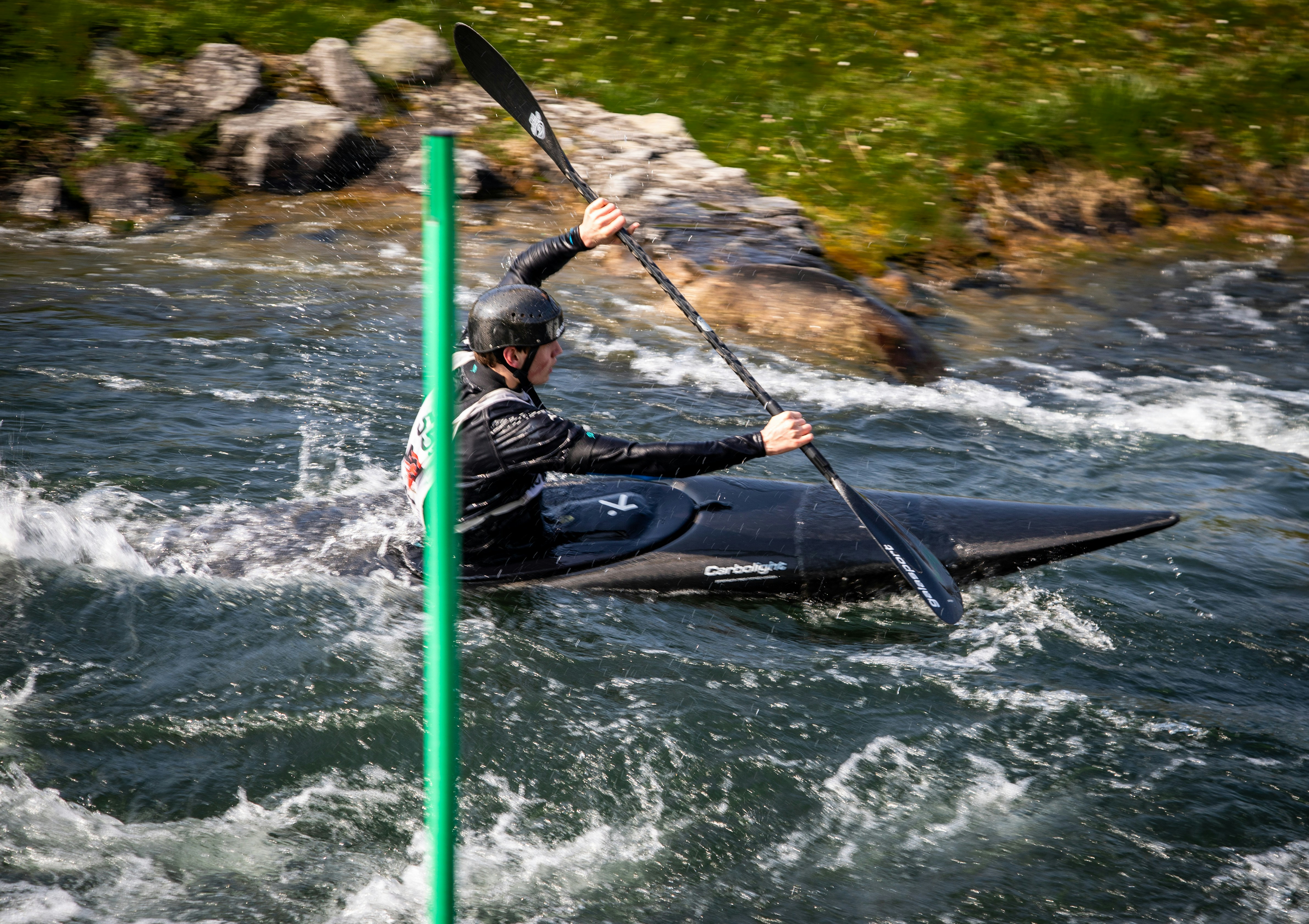 Rush of the River: Kayakist in Whitewater Dash