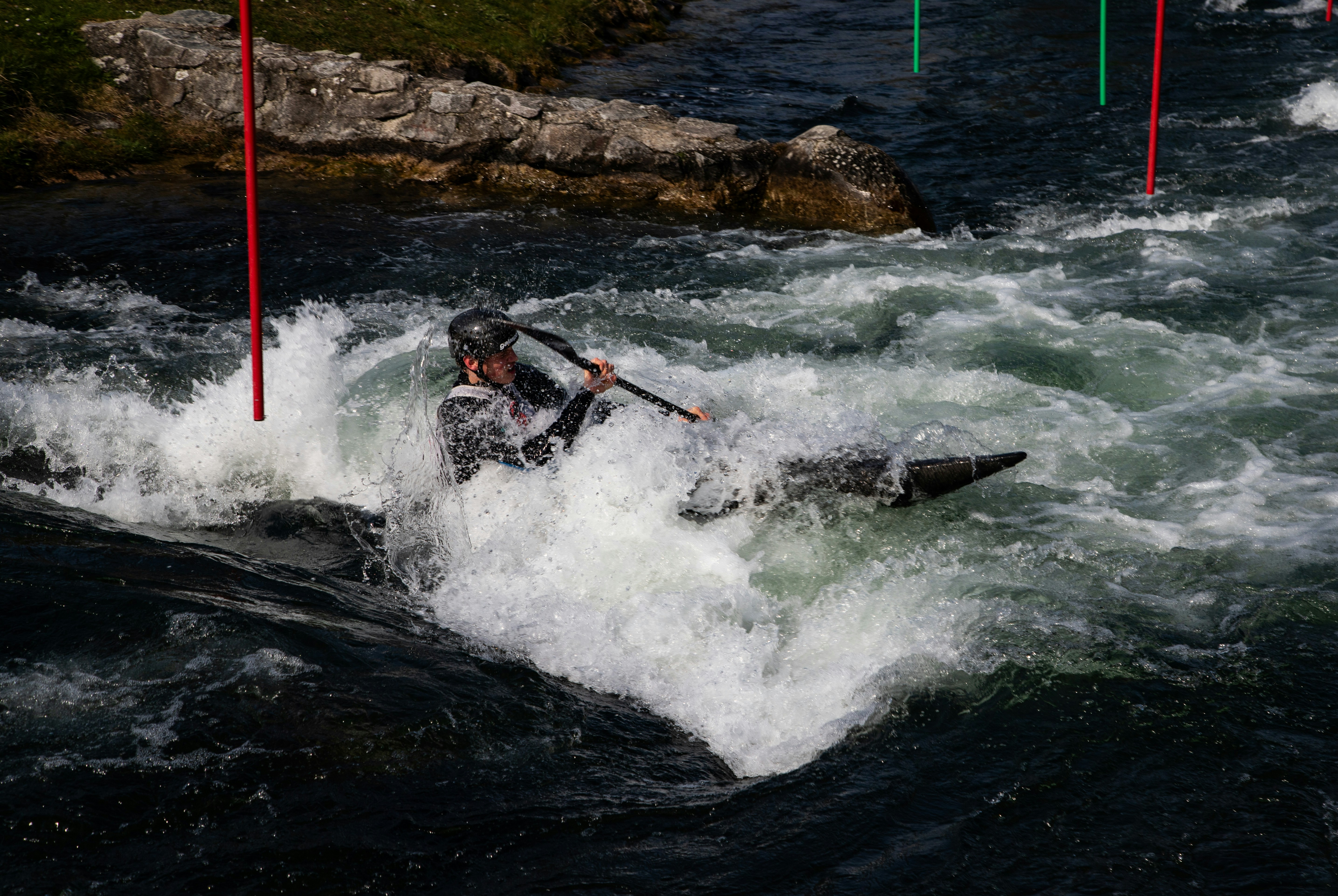 Winged through Whitewater: A Kayaker Carving the Slalom Run