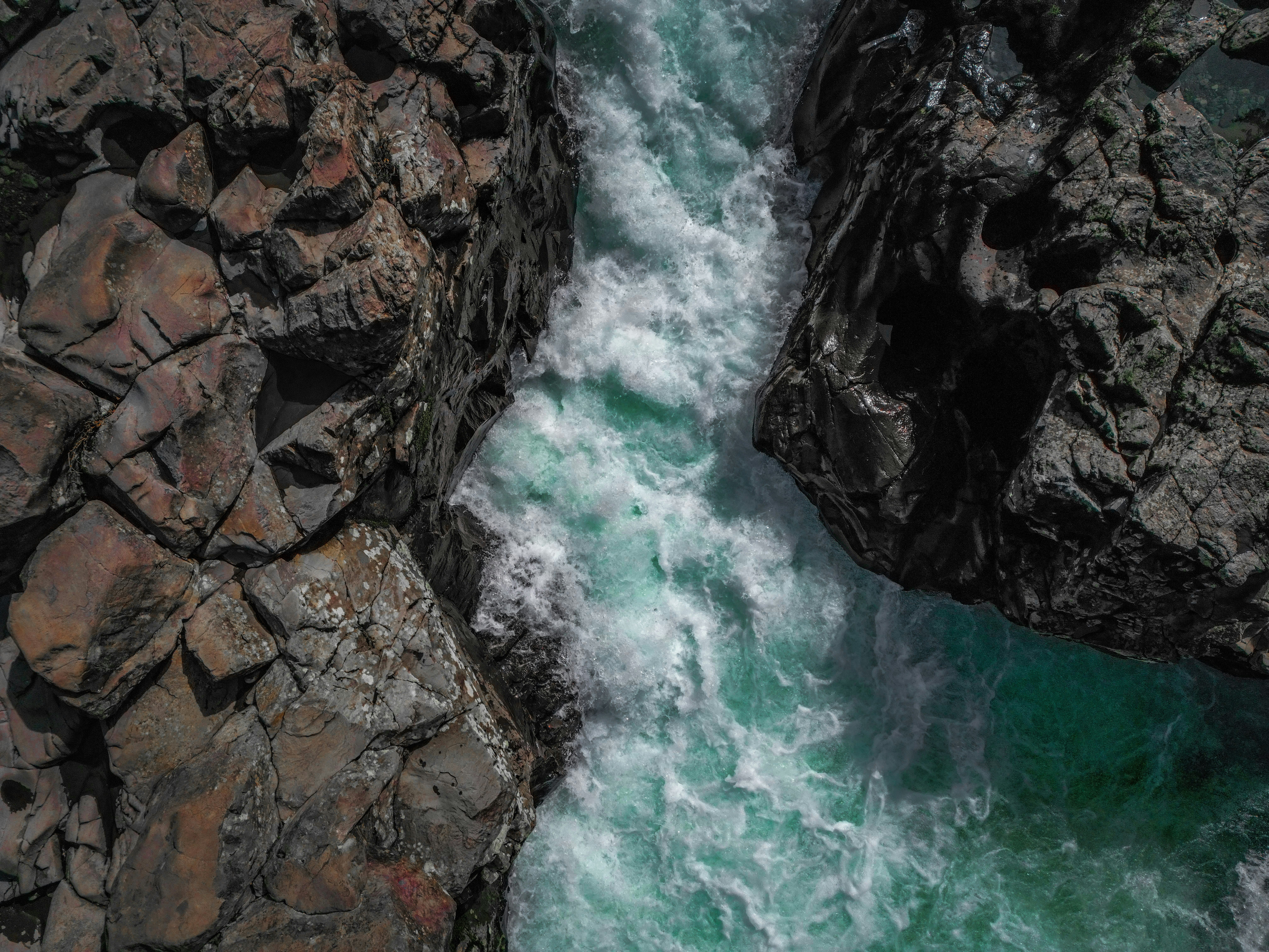 Aerialgence: Turquoise Whirl Between Dark basalt Gorges