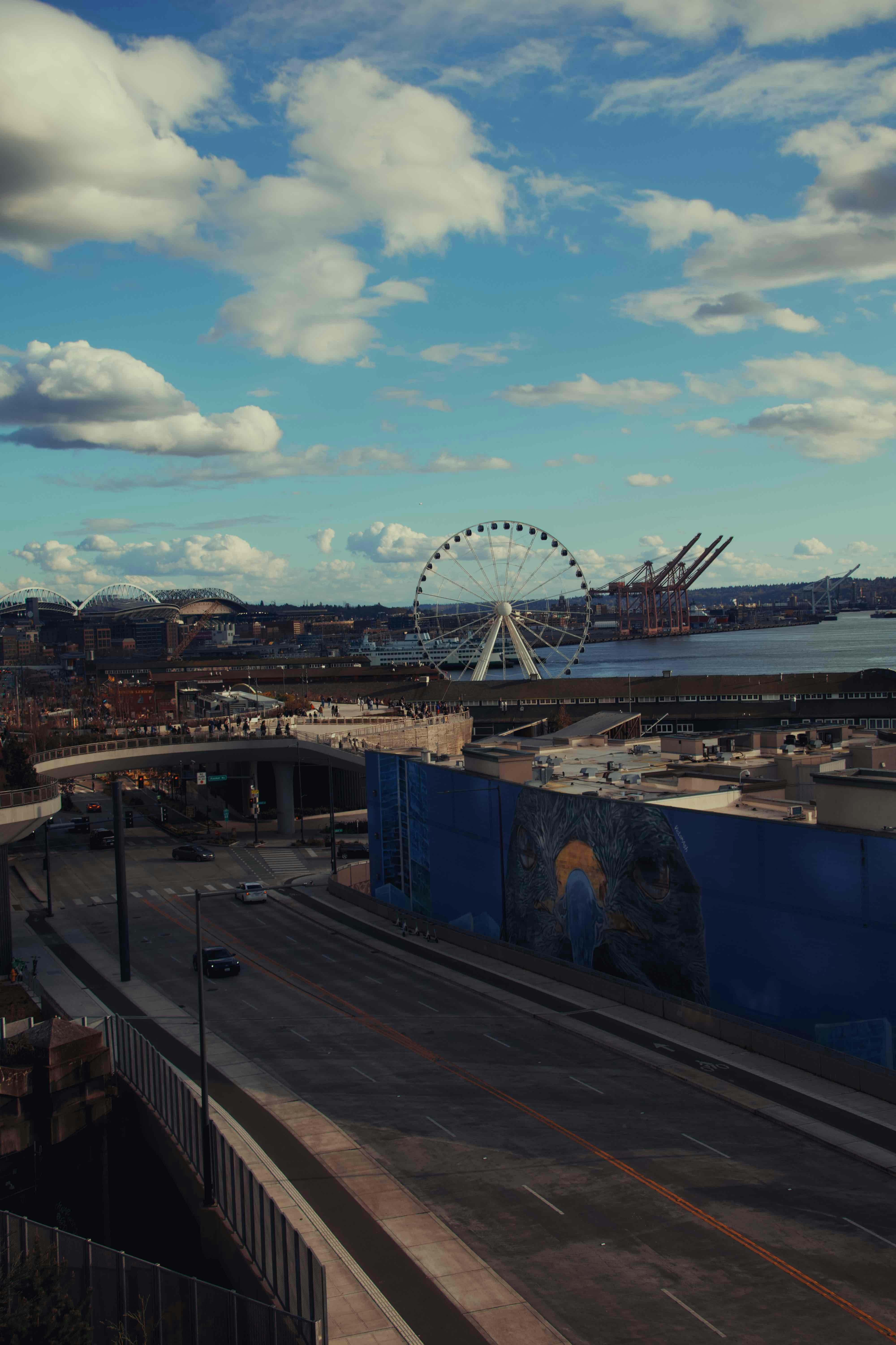 Overlook of the Waterfront City: Ferris Wheel and Crane Horizon