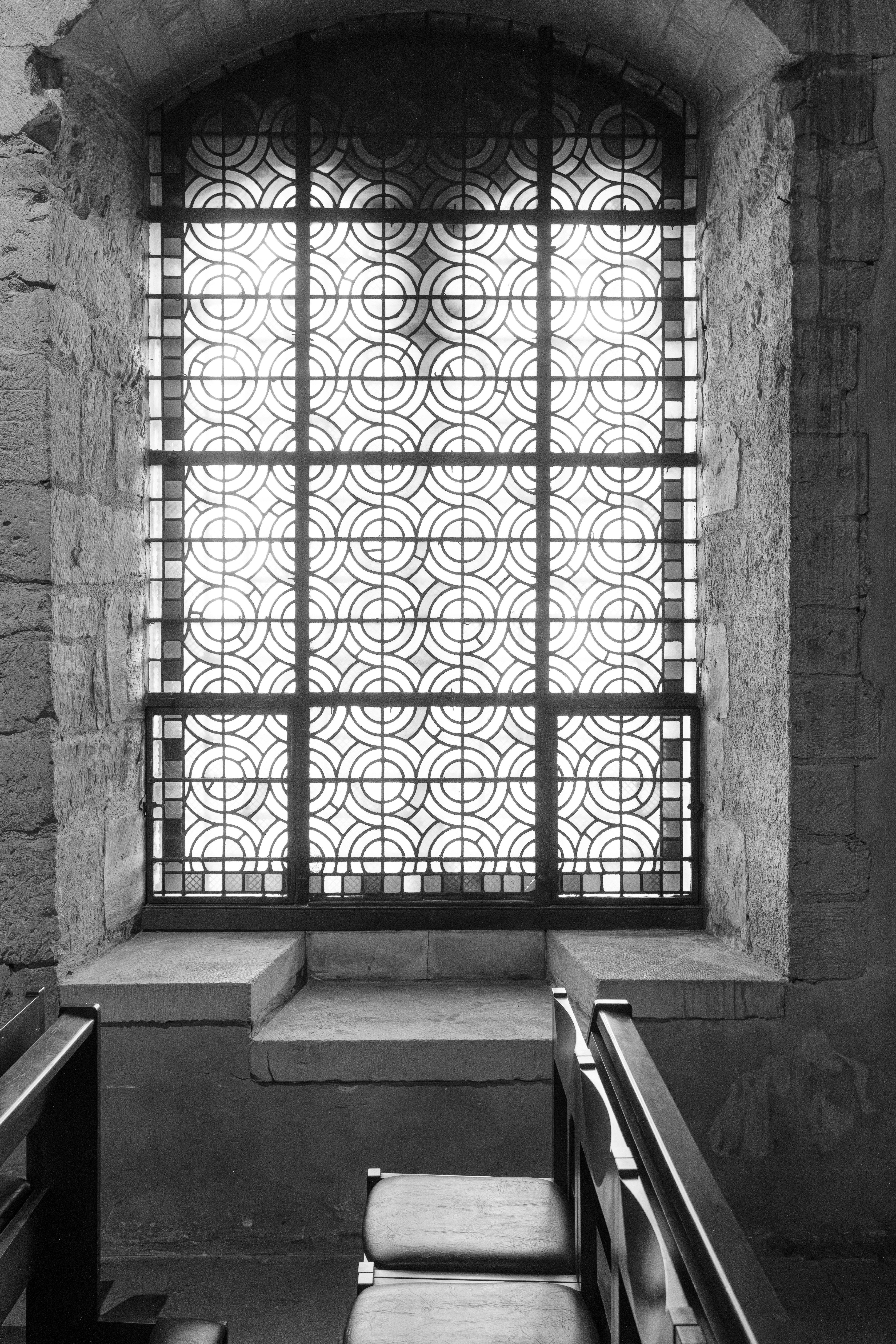 Gridded Window of Stone and Shadow