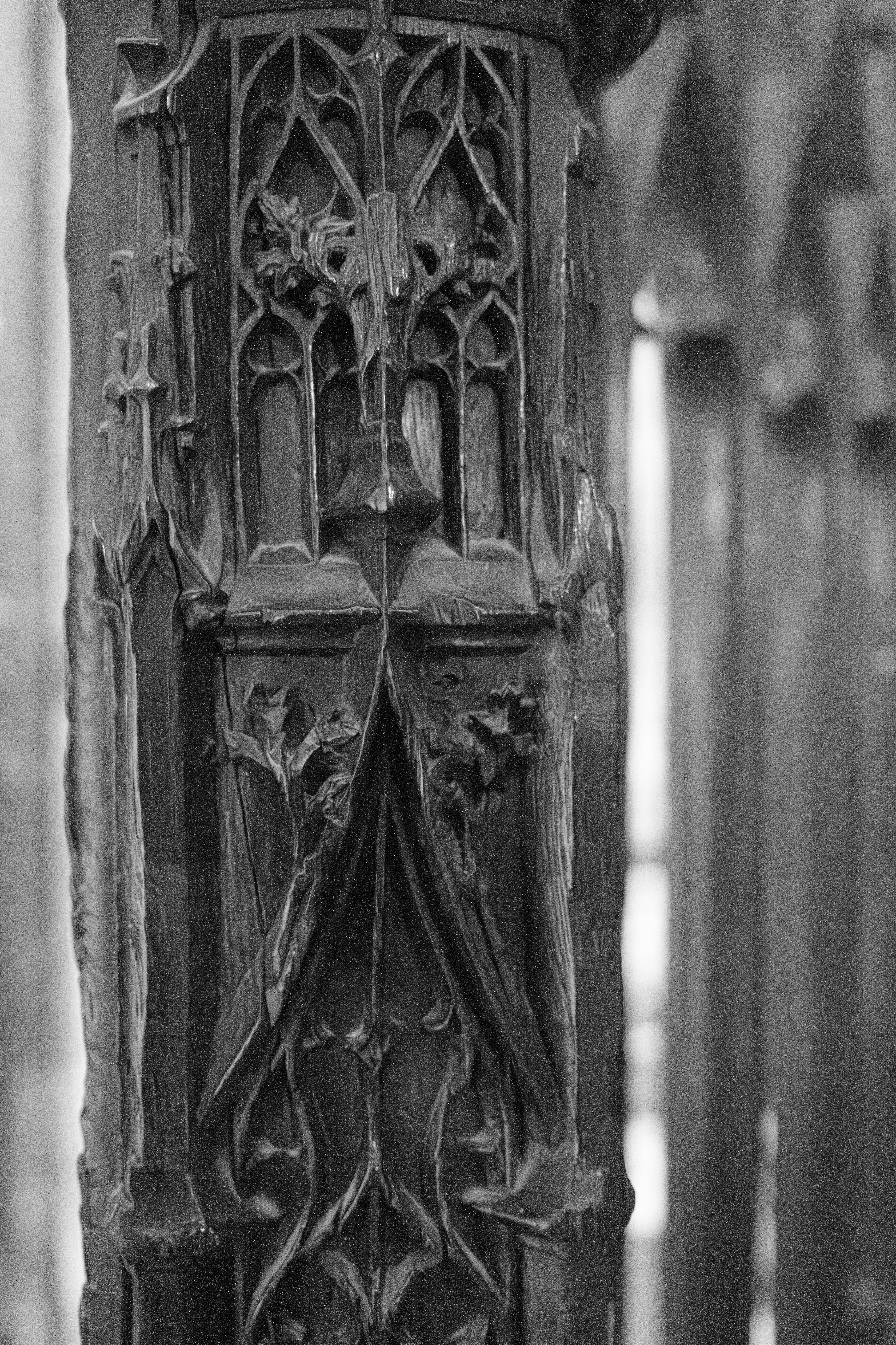 Gothic Carved Column Fragments in a Dim Corridor