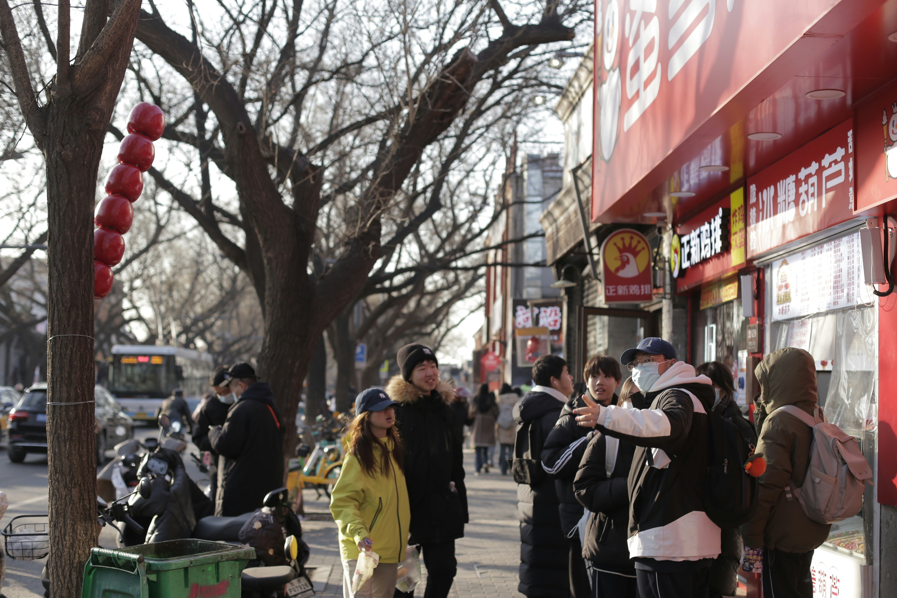 Street Exchange: People Gathered Outside a Market Facade
