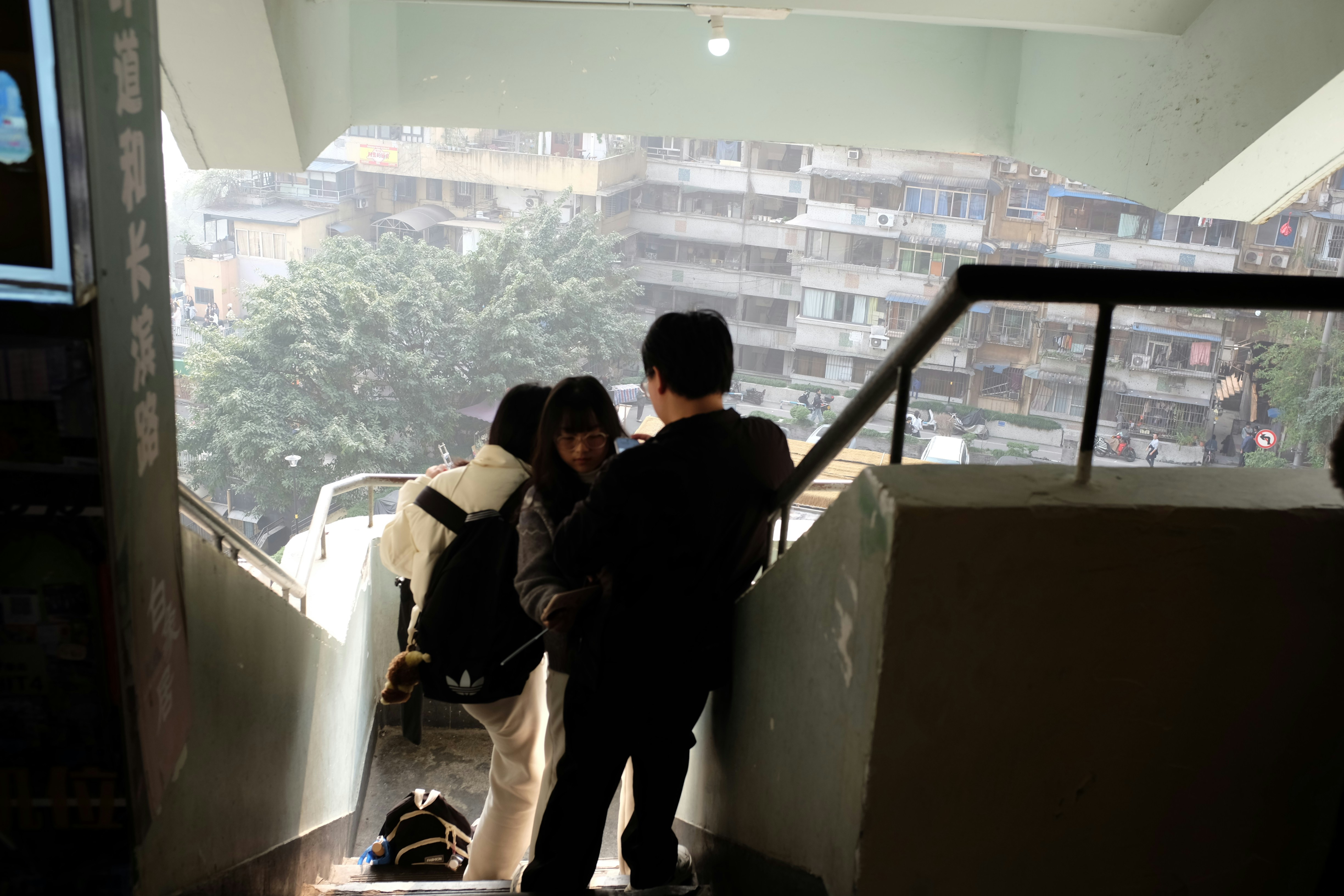 Stairwell Convergence: Faces in Conversation by the Elevator