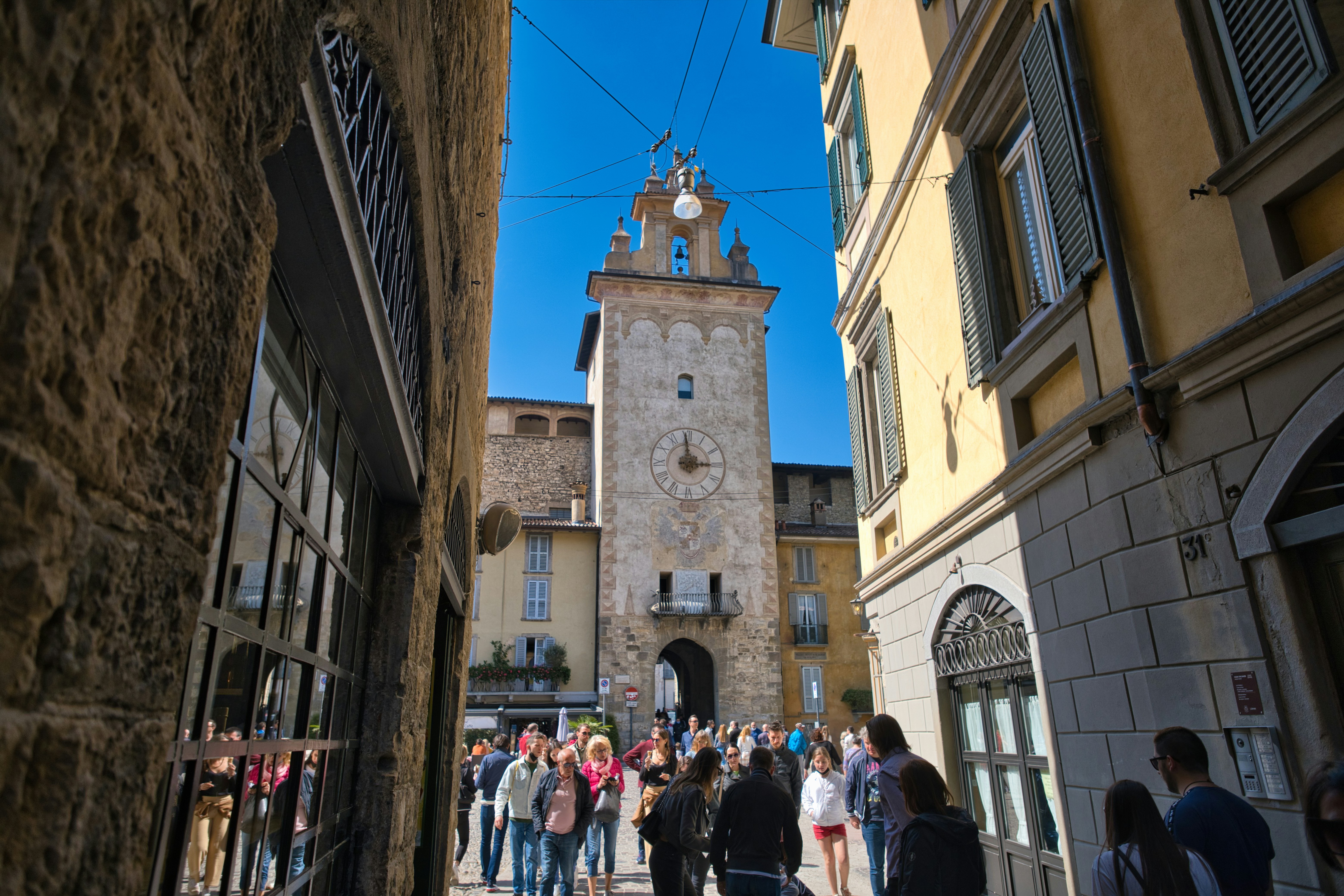 Clock Tower Atrium: A Sunlit Piazza Framed by Historic Walls