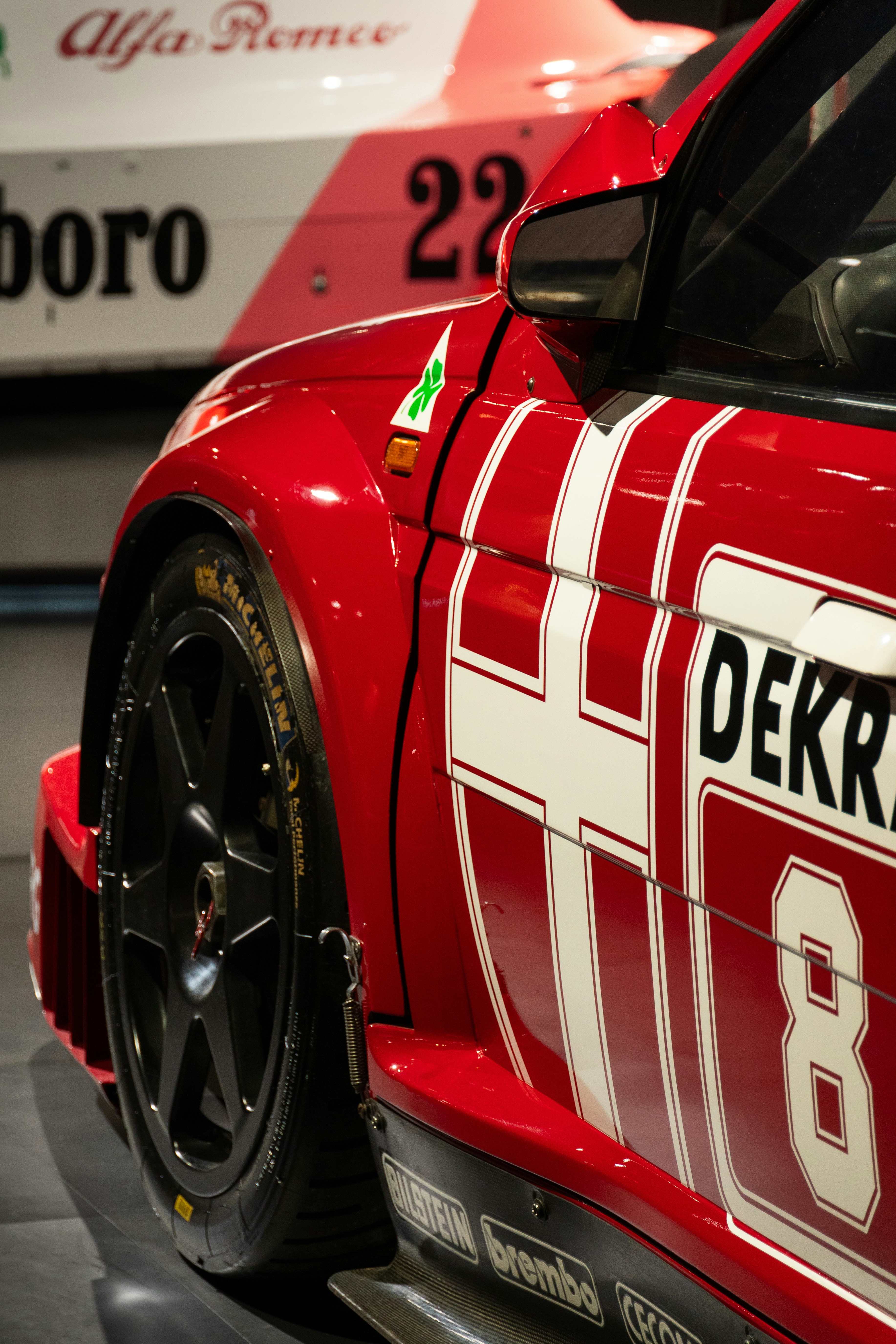Red Rally: Close-Up of a Racing Car's Livery and Wheel Detail