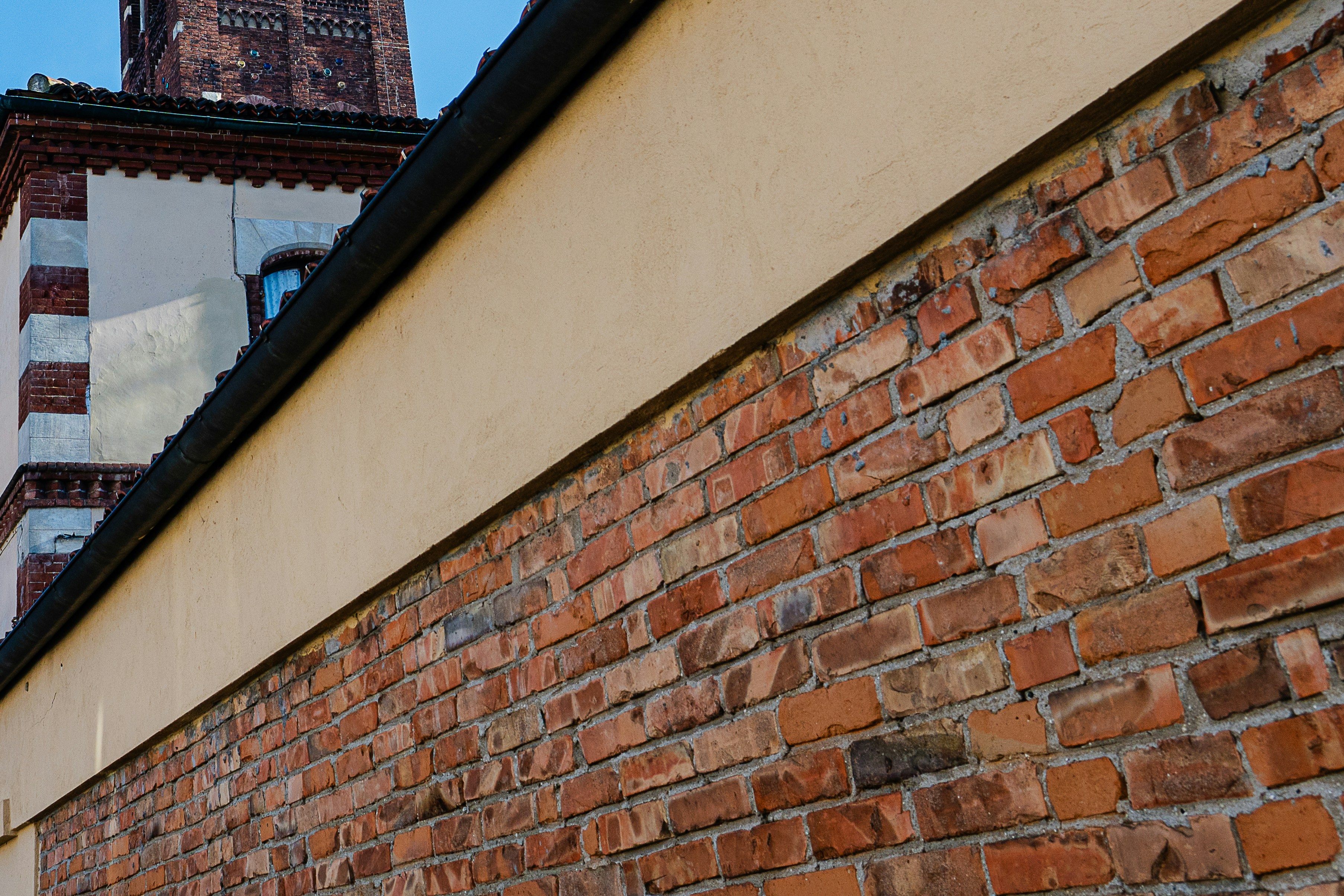 Brickwork Perspective: A Quiet Tilt Up from the Wall to the Rooftop