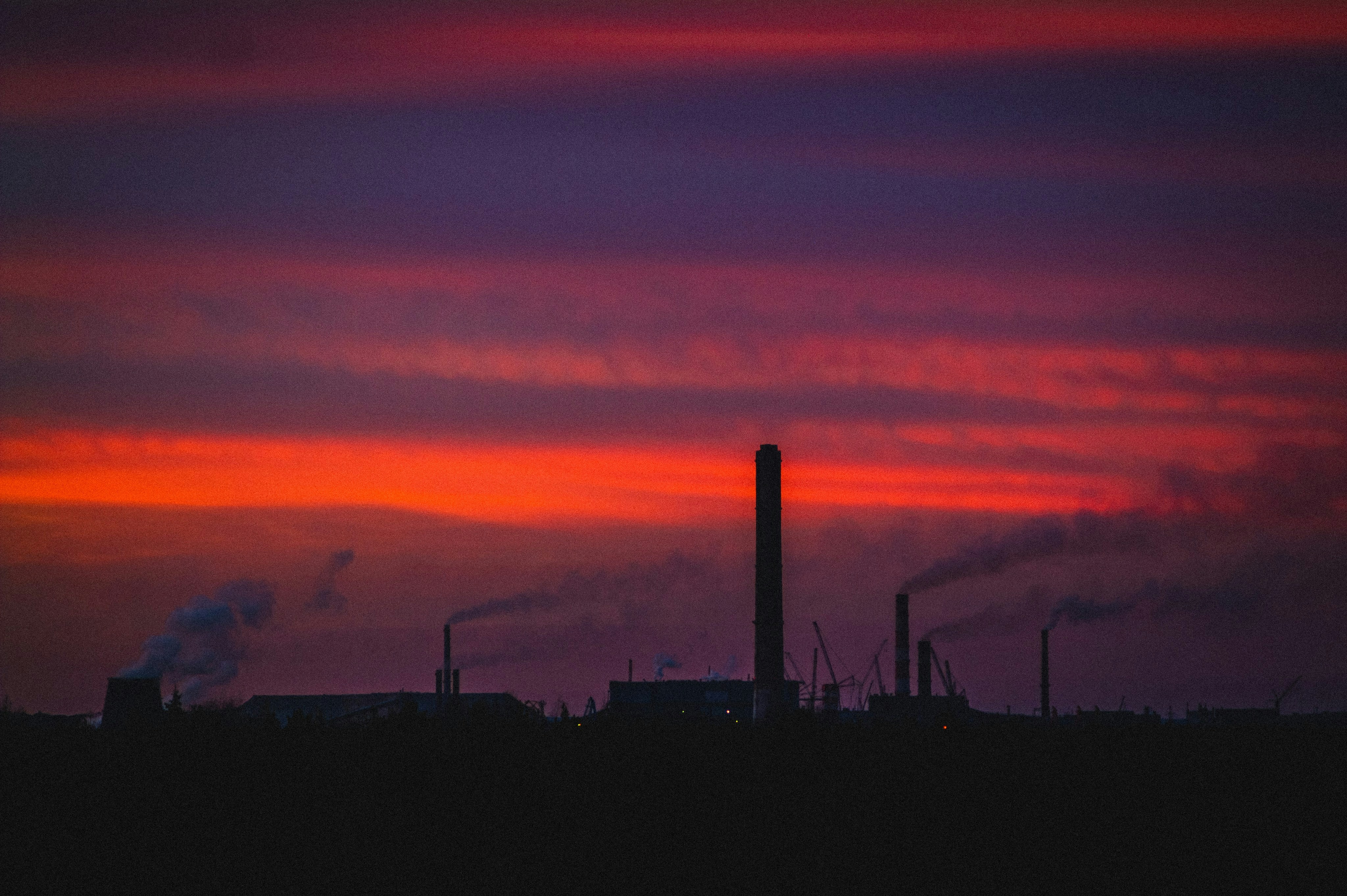 Crimson Horizon Over a Silent Industrial Frontier