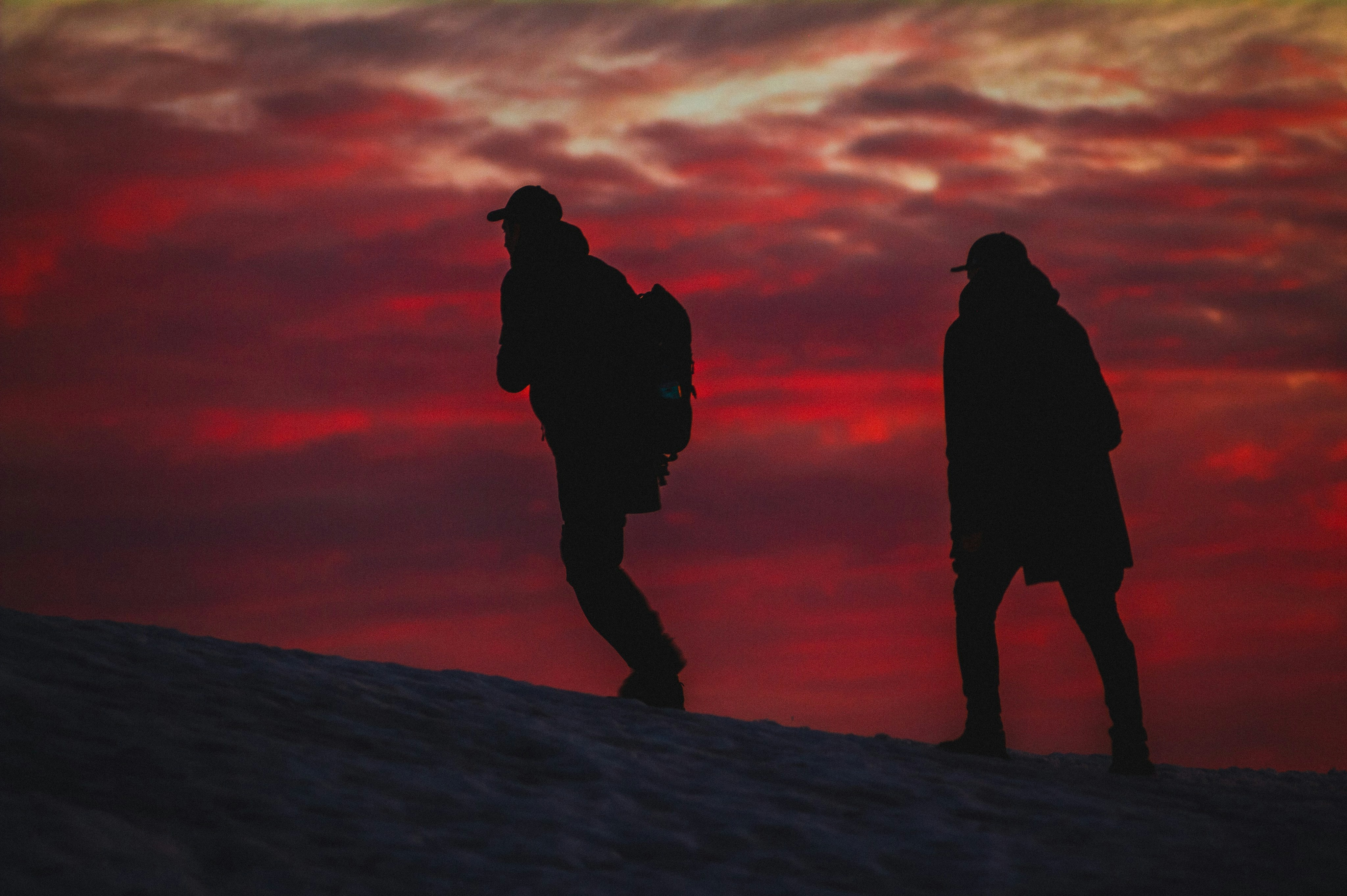 Silhouetted Travelers Against a Fiery Dusk