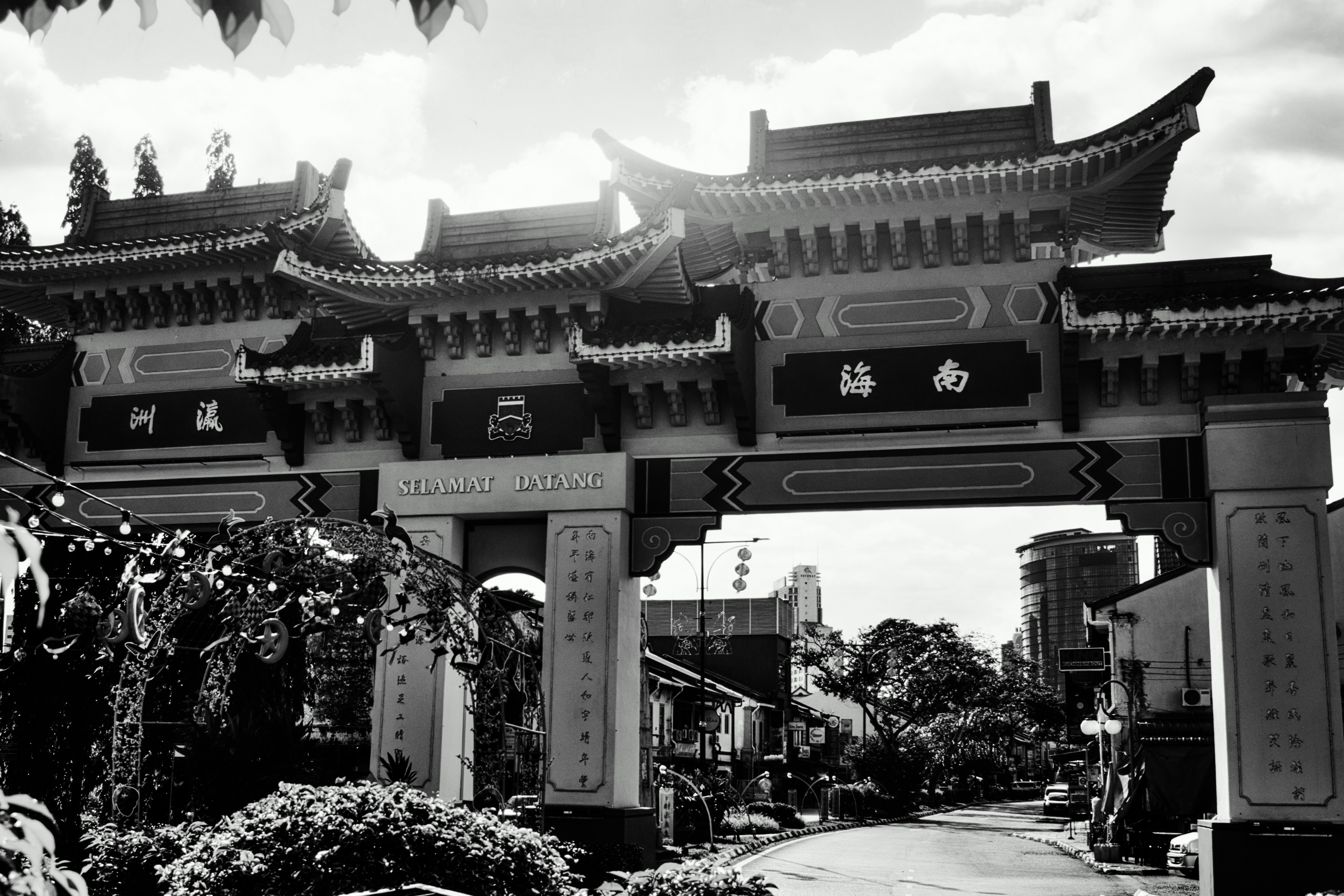 Gateway of Hometown: A Quiet Street Beneath an Ornate Chinese Arch