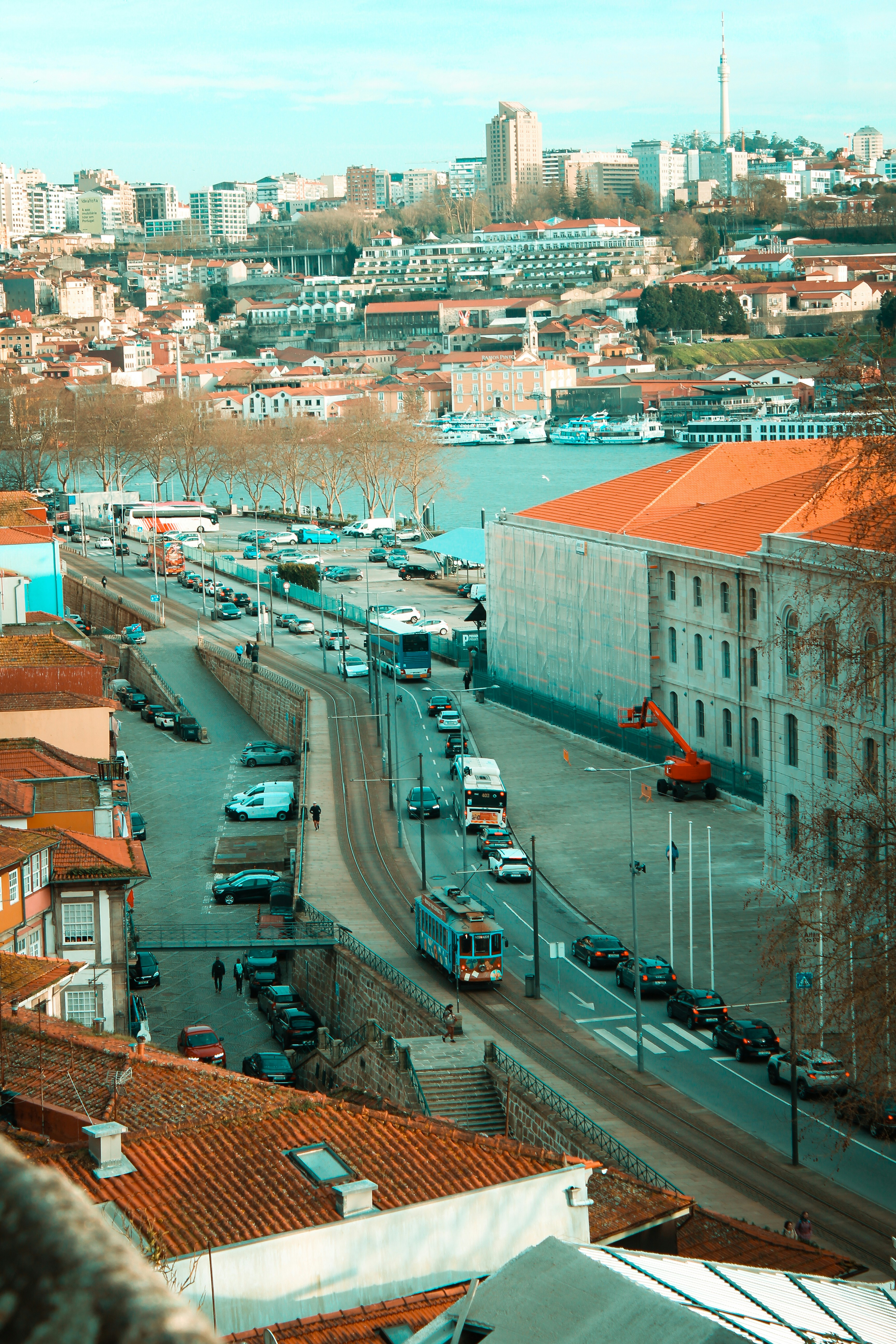 City by the Hill: A Riverside Tangle of Roads and Red Tile Walls