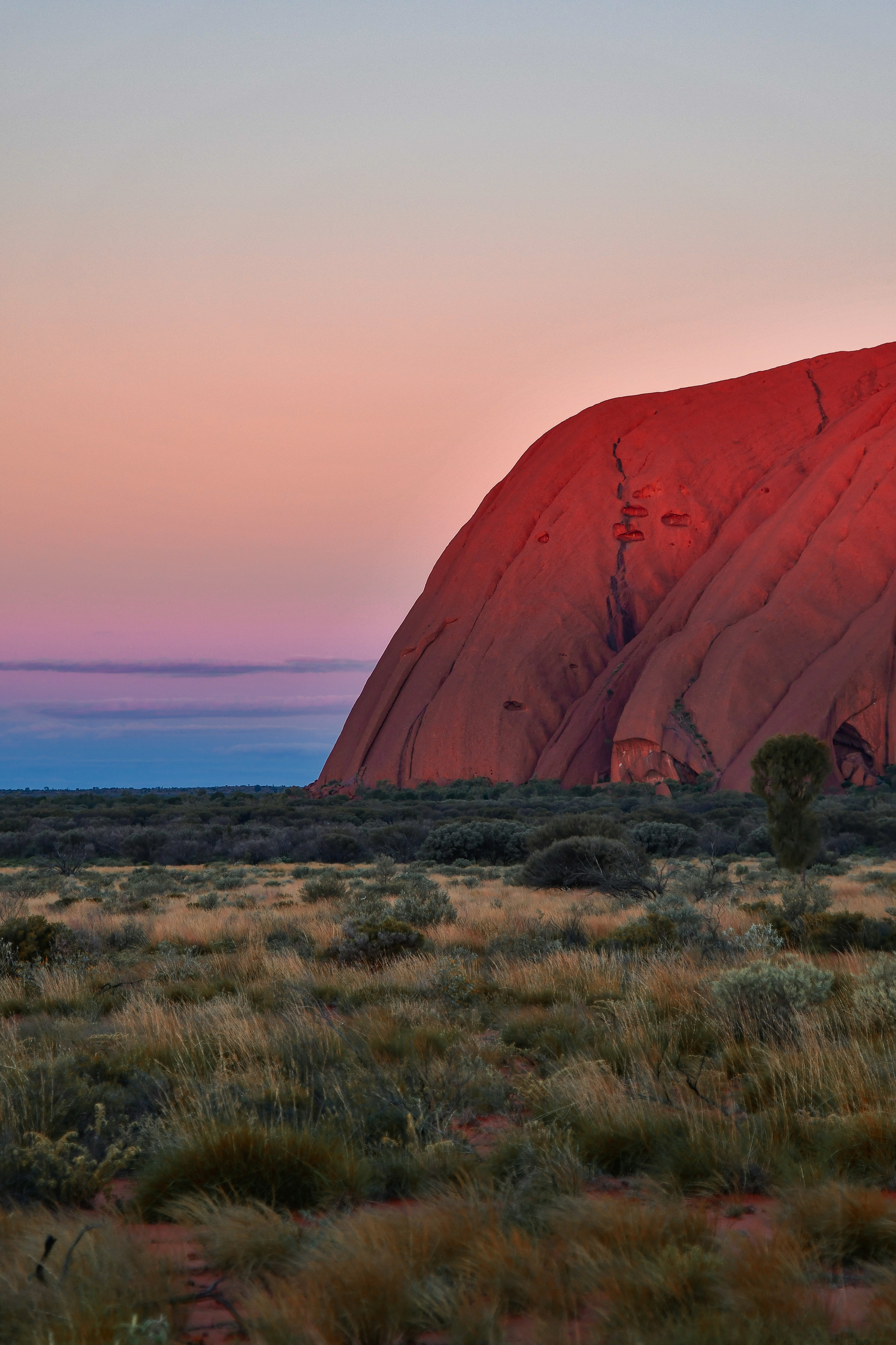 Sunset Granite: Crimson Monolith Rising Over Desert Flats