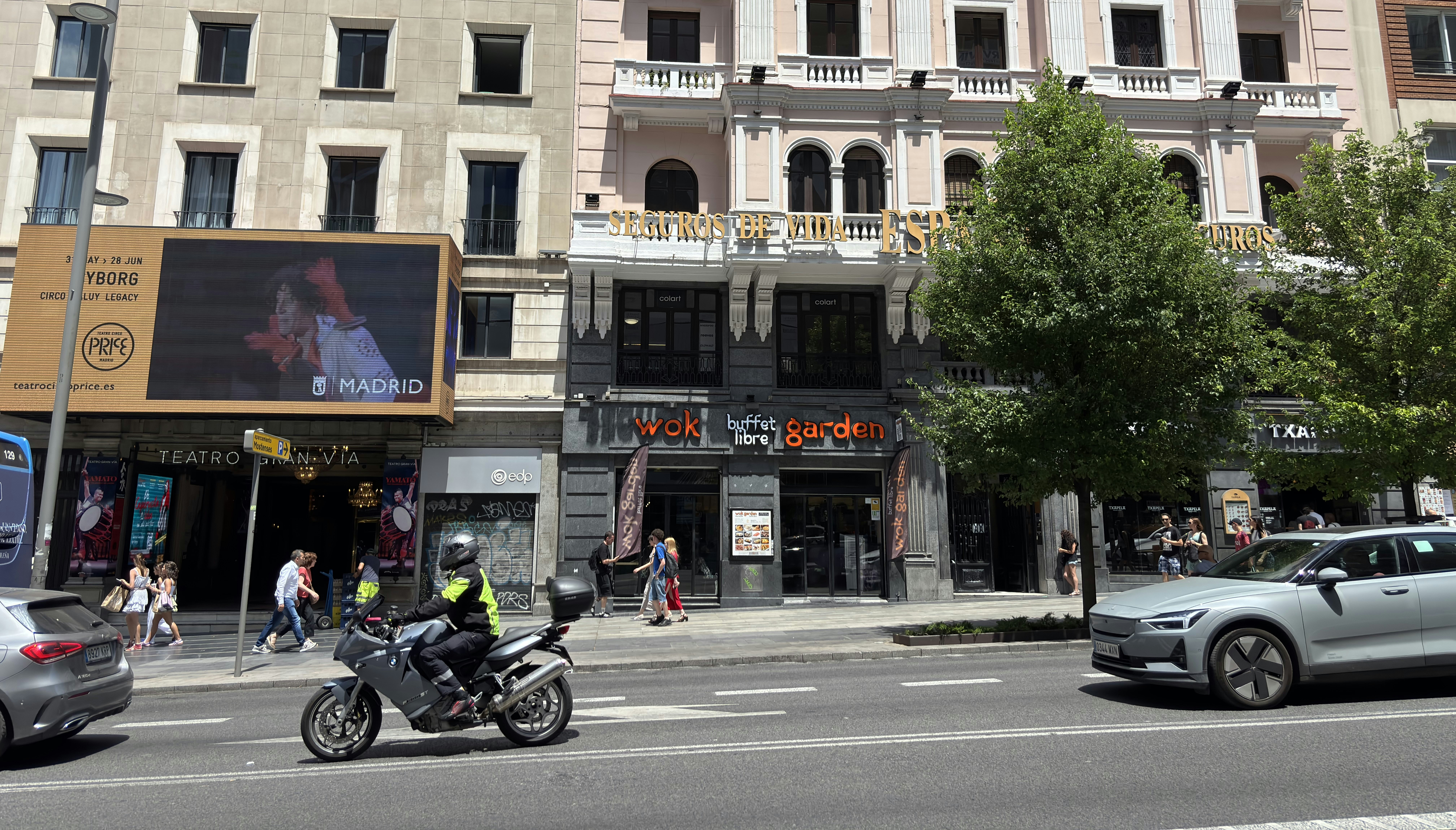 Street-Level Snapshot: Motorbike in Front of Historic Facade
