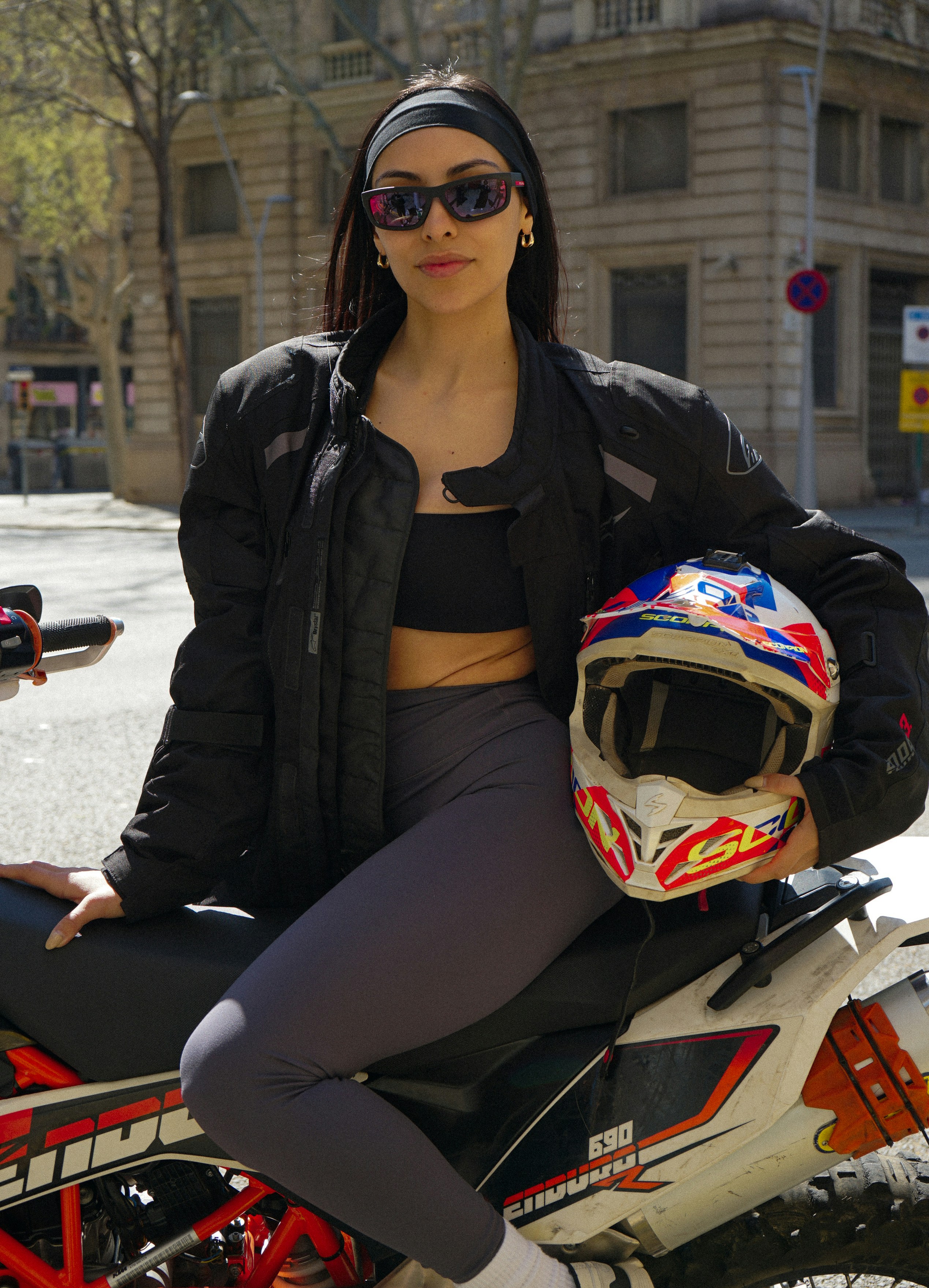 Moto-Chic: A Rider's Quiet Confidence on City Streets