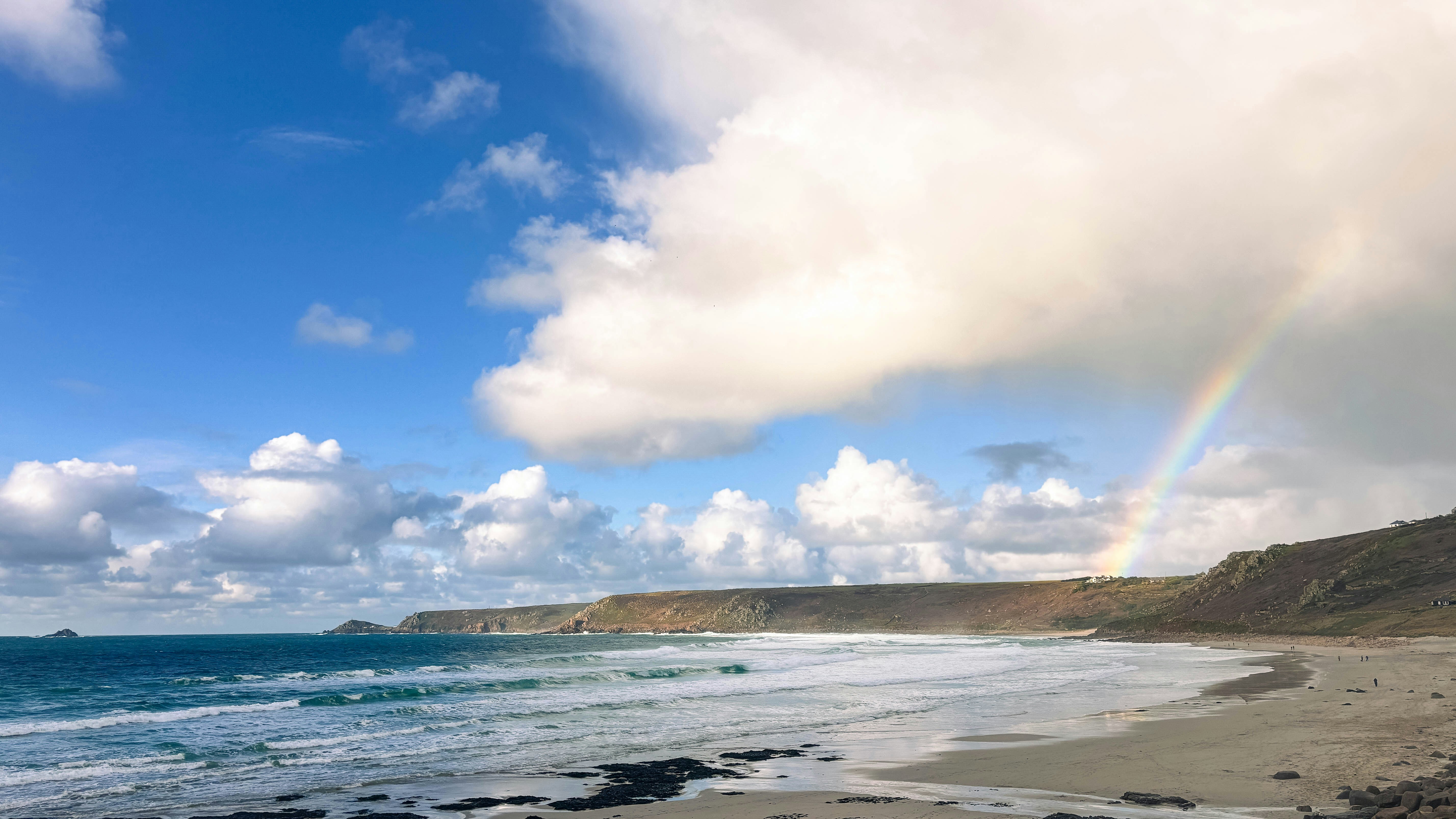Rainbow Over the Quiet Shore: A Seaside Sky Painted in Soft Light