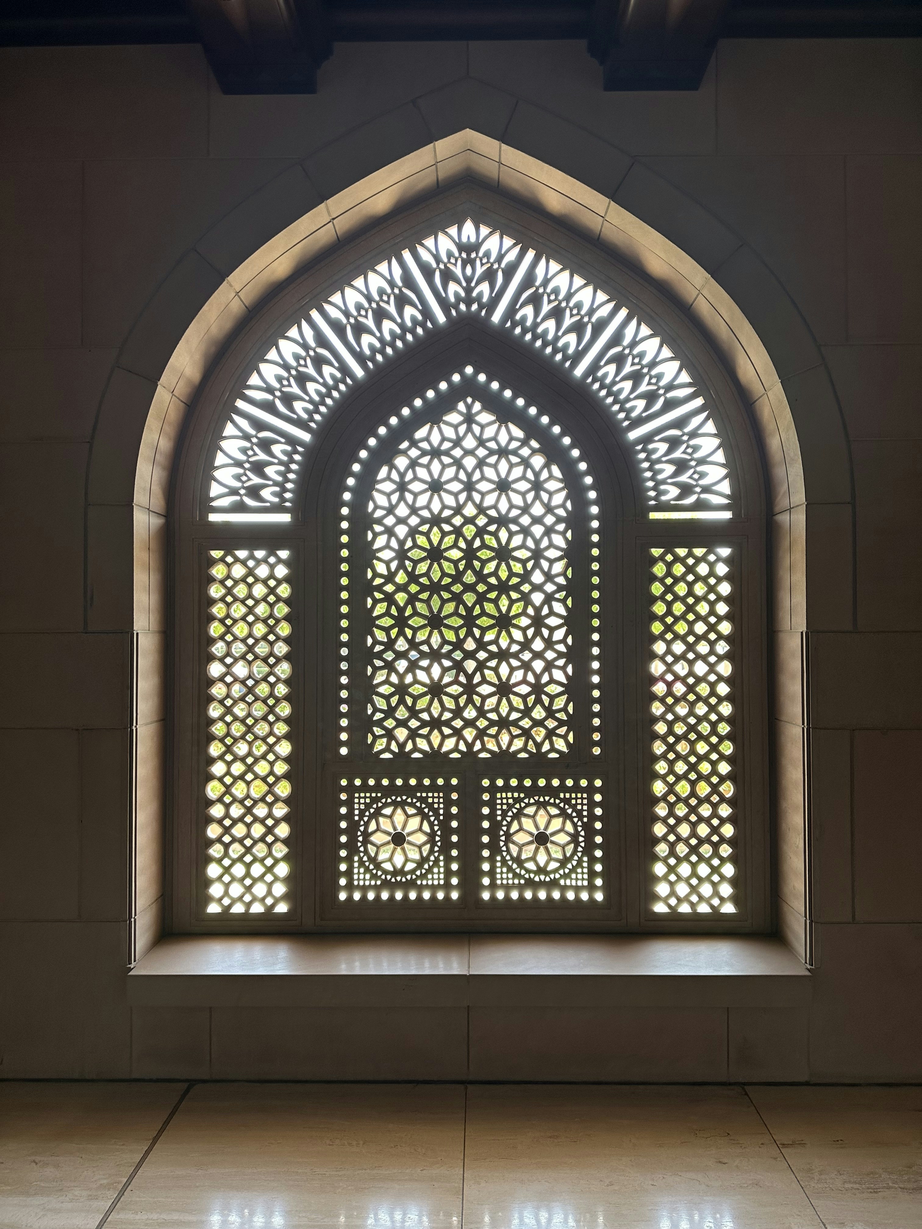Arched Window of Light: Geometric Lattice in Stone