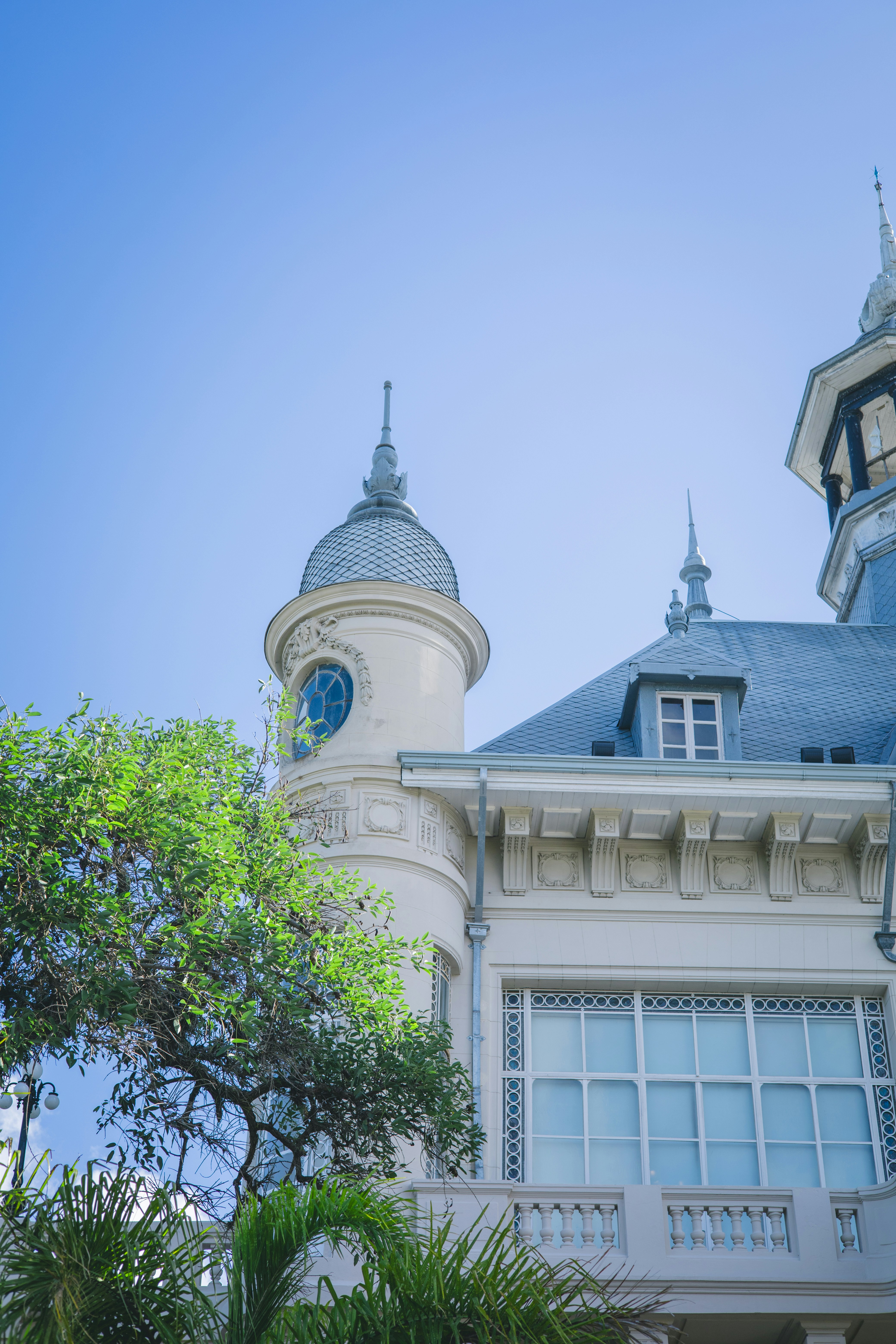 Whimsical Chateau Rooftop with Blue Skies