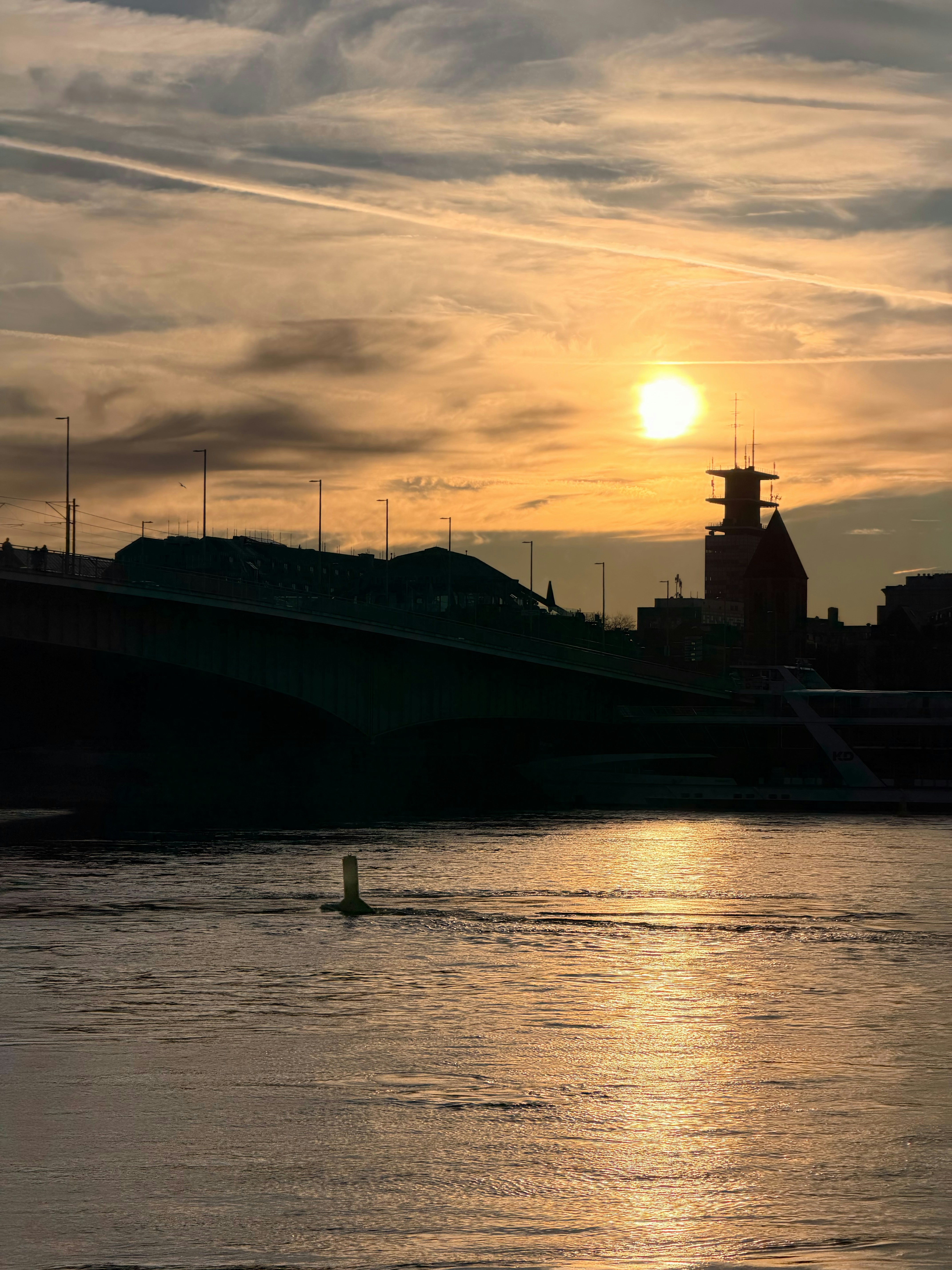 Dusk Over the River: Sunset Silhouette at the Bridge