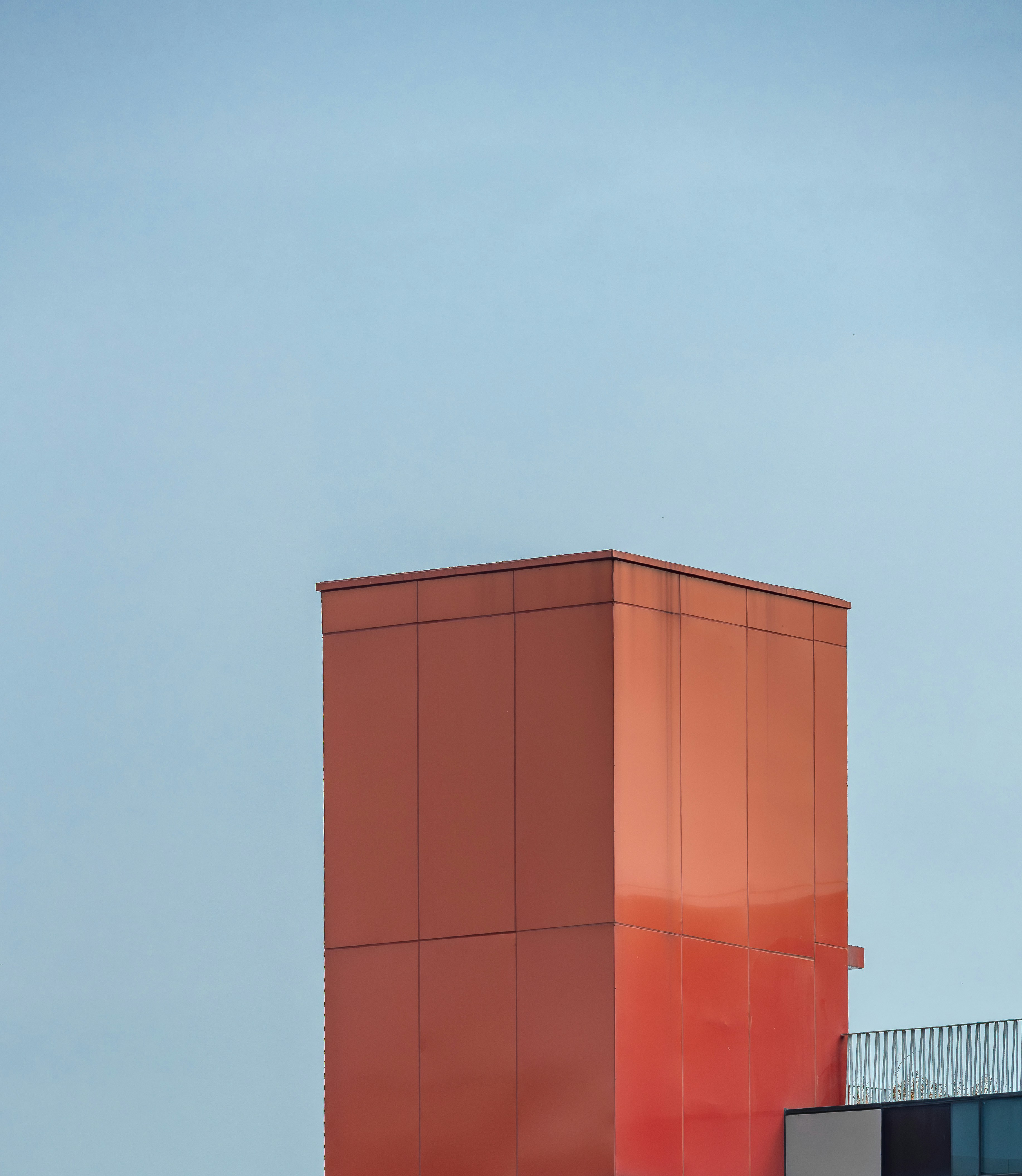 Crimson Tower Against a Clear Sky