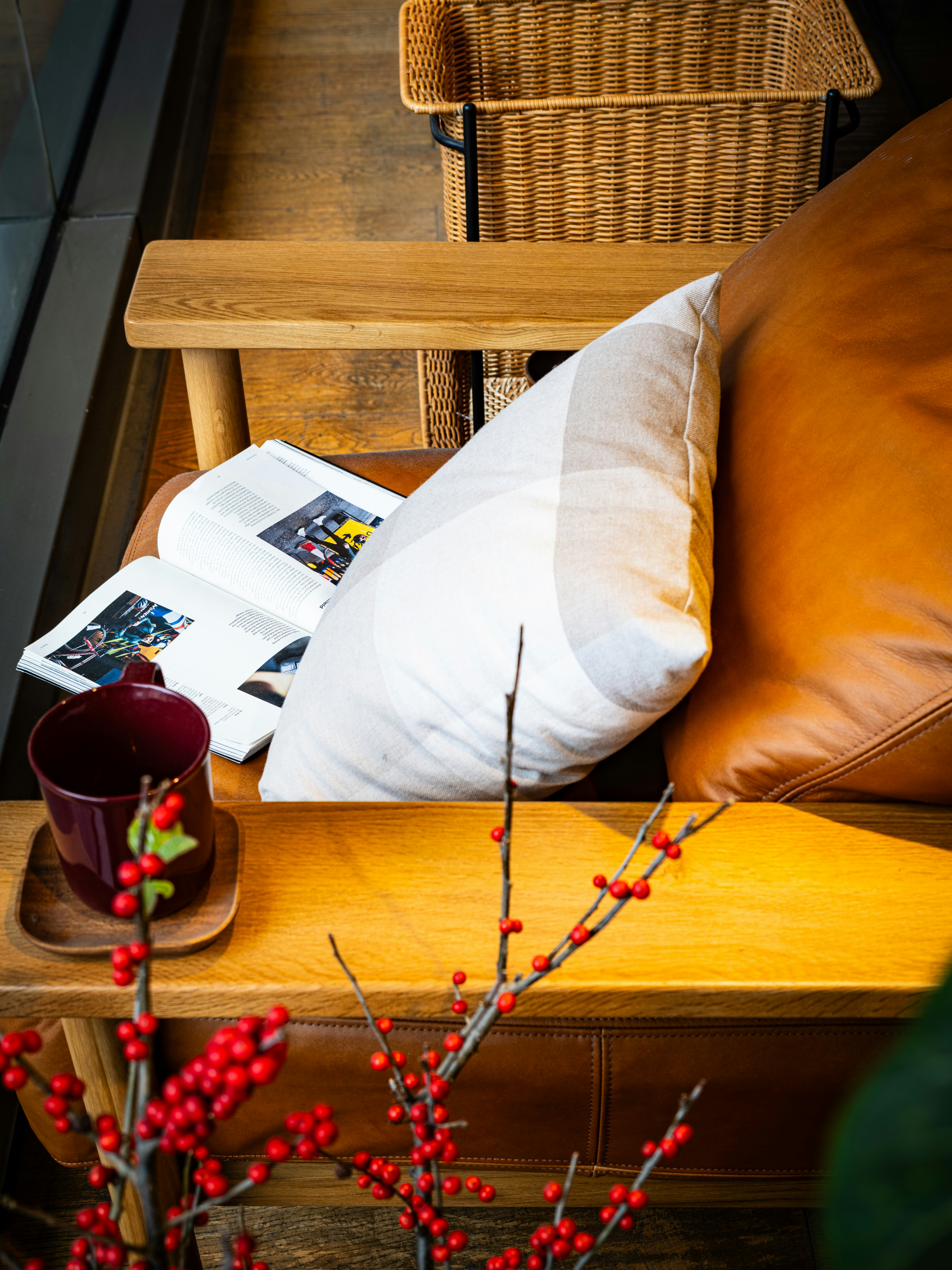 Cozy Corner: Reading Nook by Warm Leather and Red Berries