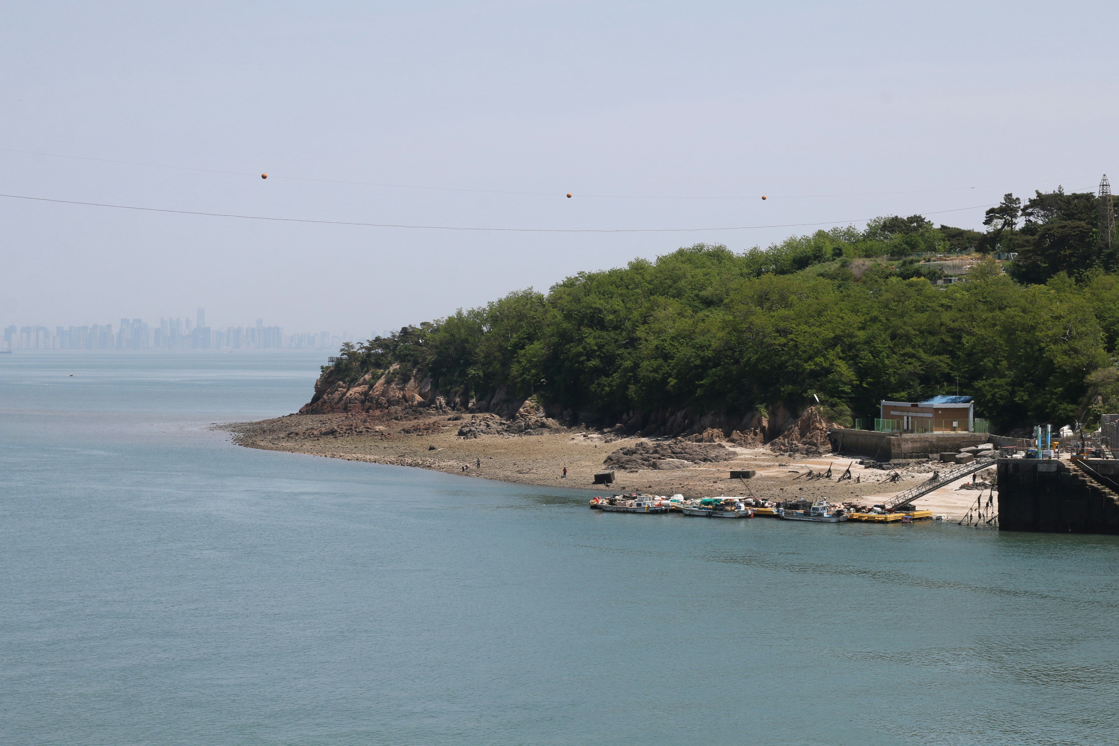 Harbored shoreline under a calm horizon