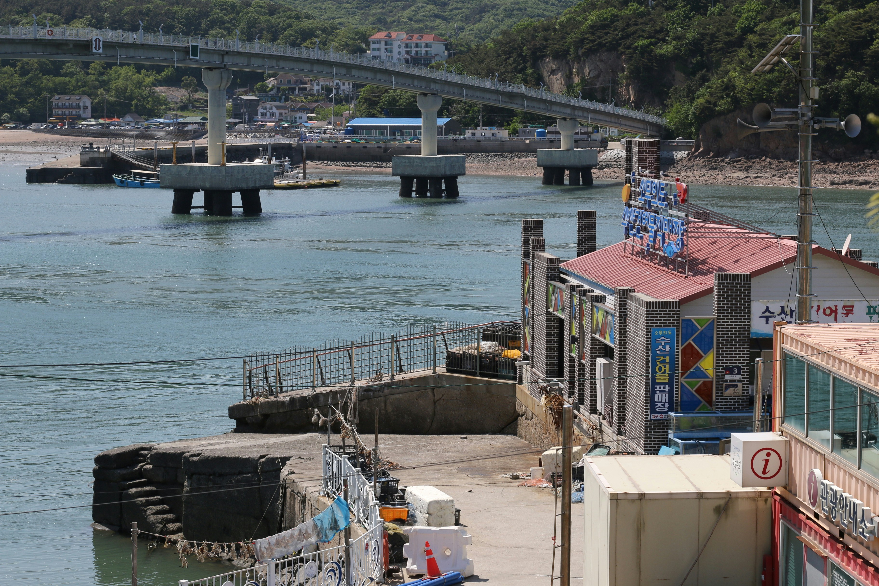 Bridge Over Quiet Harbor: A Coastal Corner with Colorful Buildings