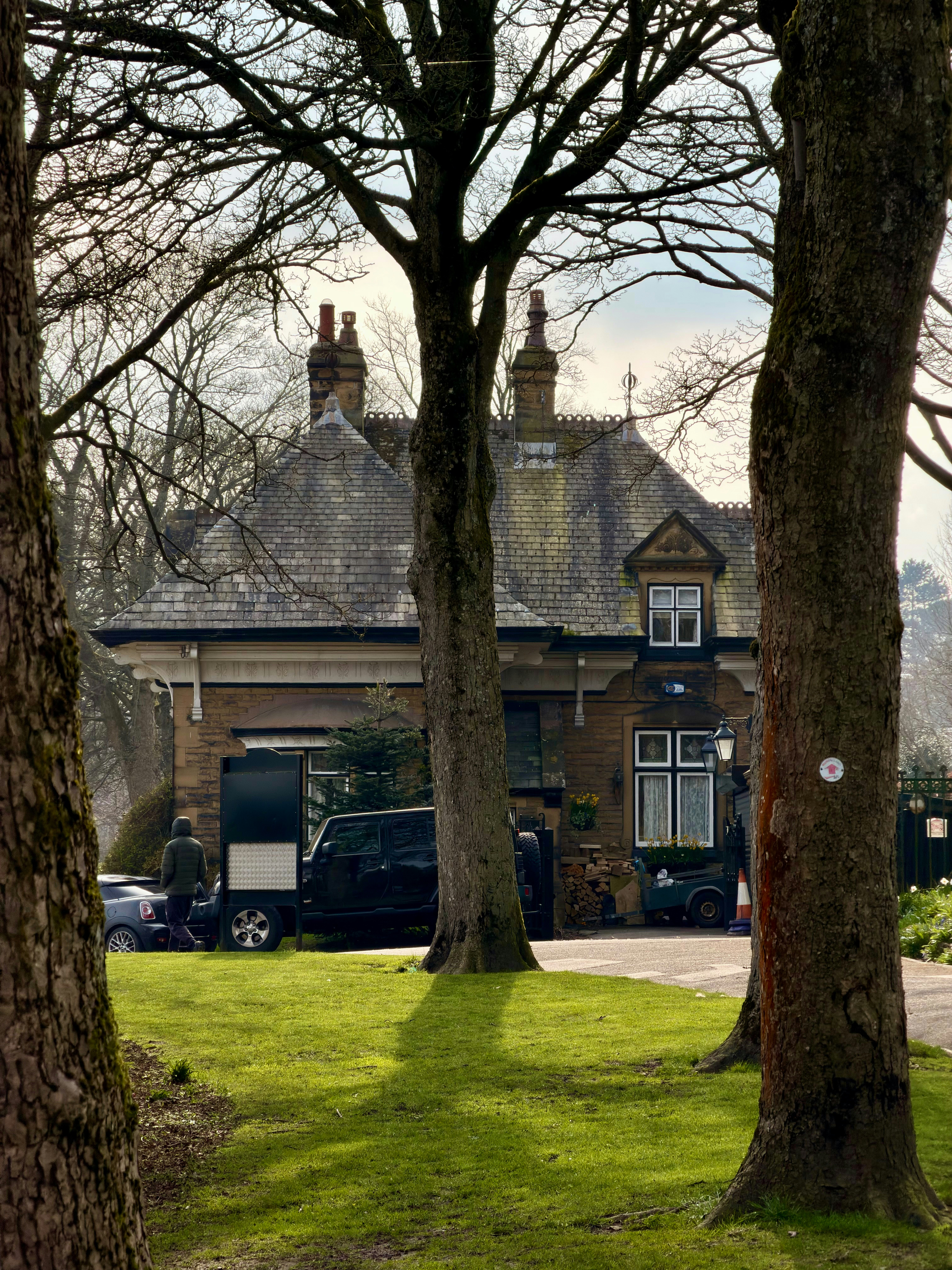 Brick Cottage Through a Quiet Park