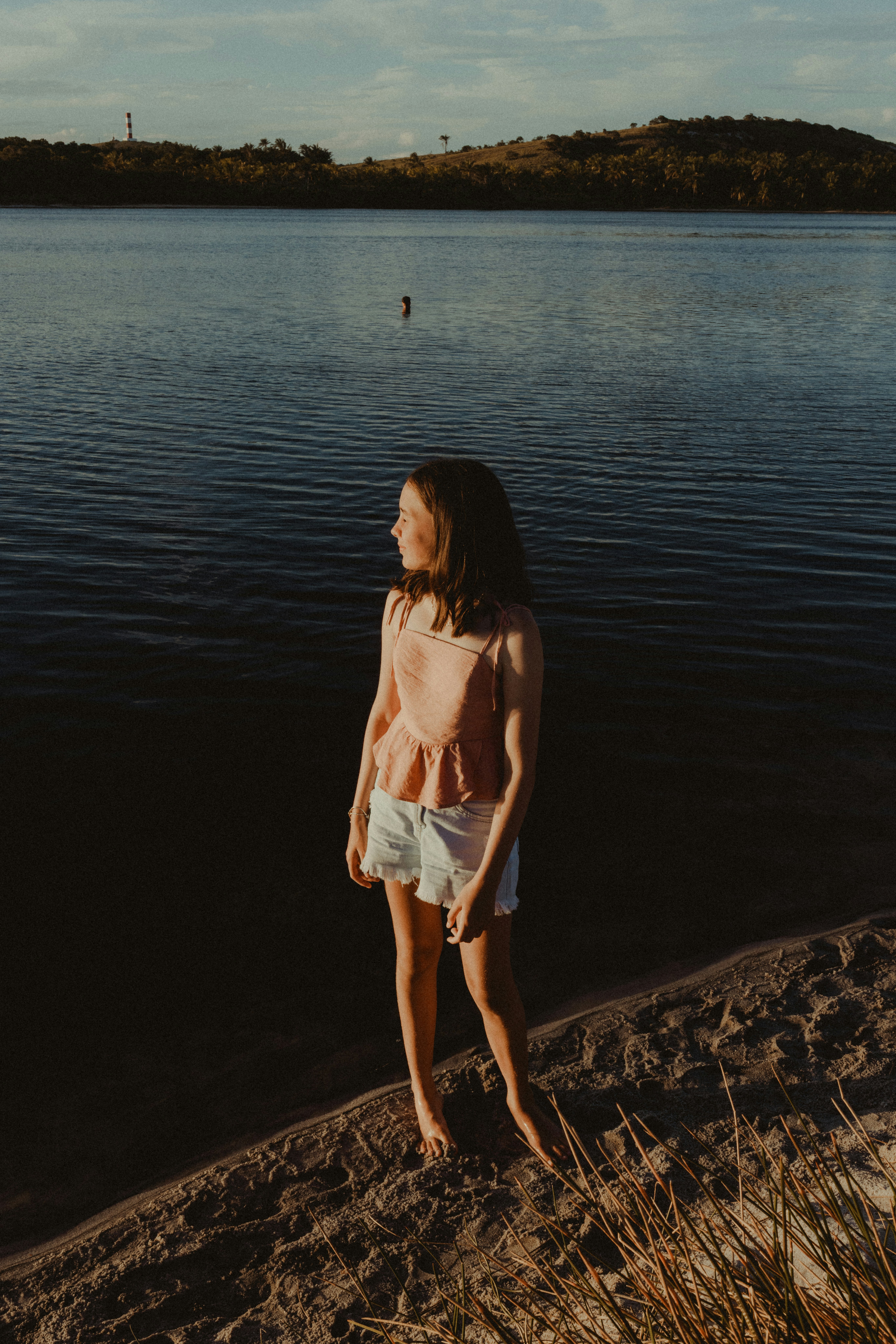Girl by the Water’s Edge at Dusk
