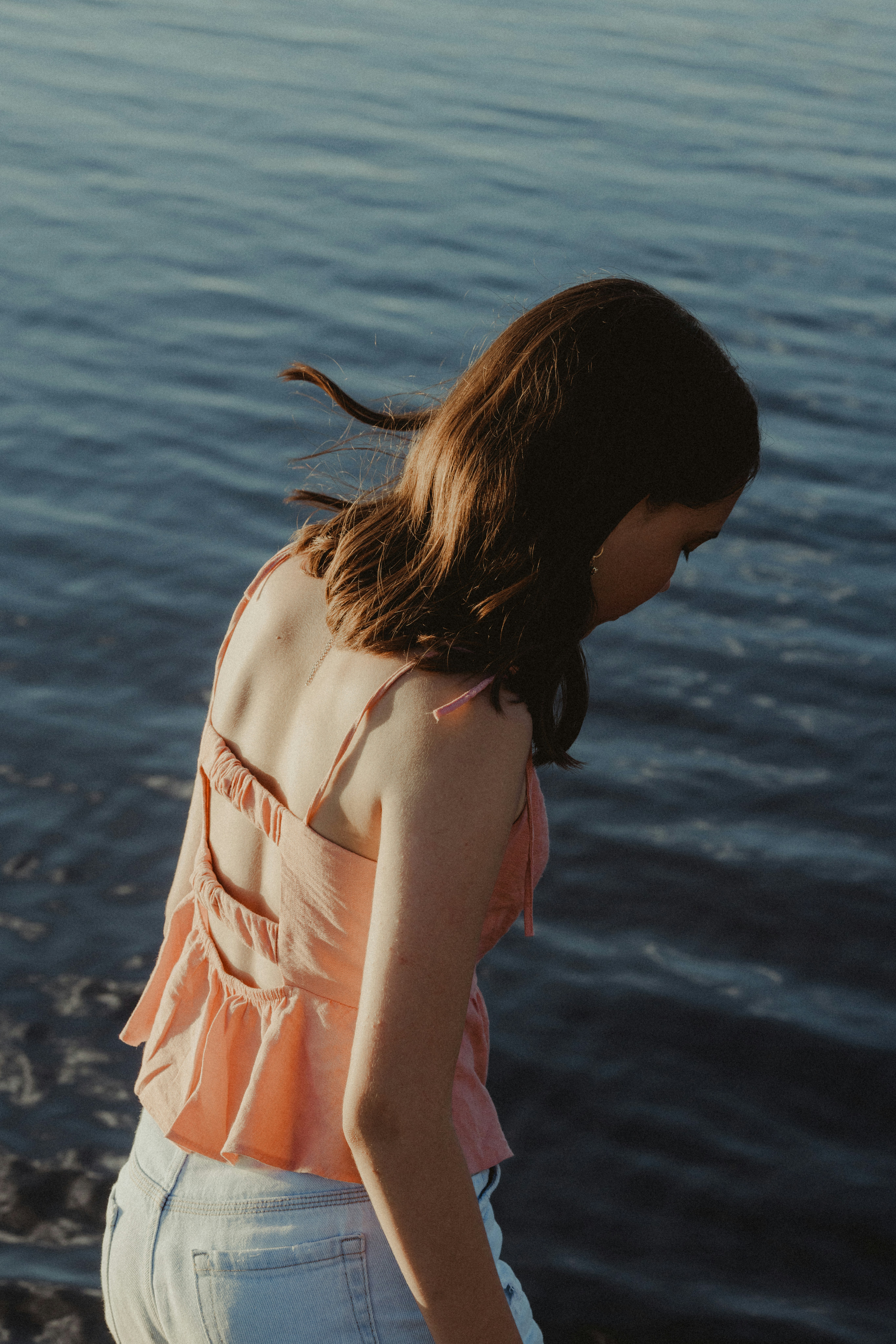 Sunlit Backlight: A Woman by the Shore