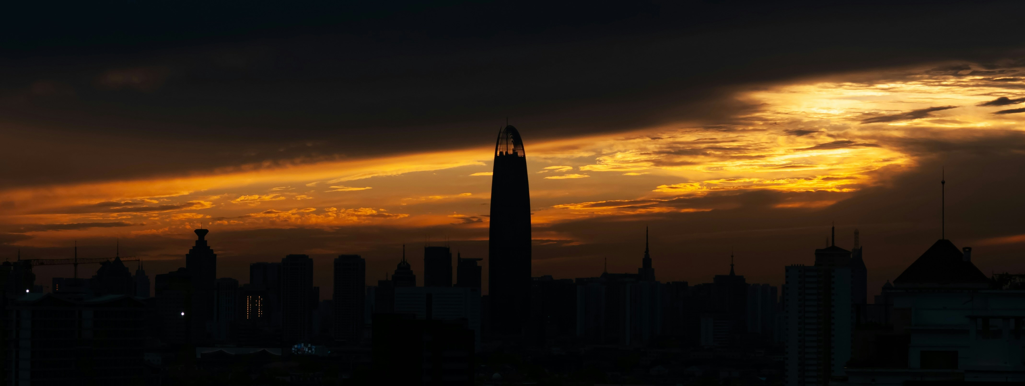 Silhouette at Sunset: A Quiet City Edge