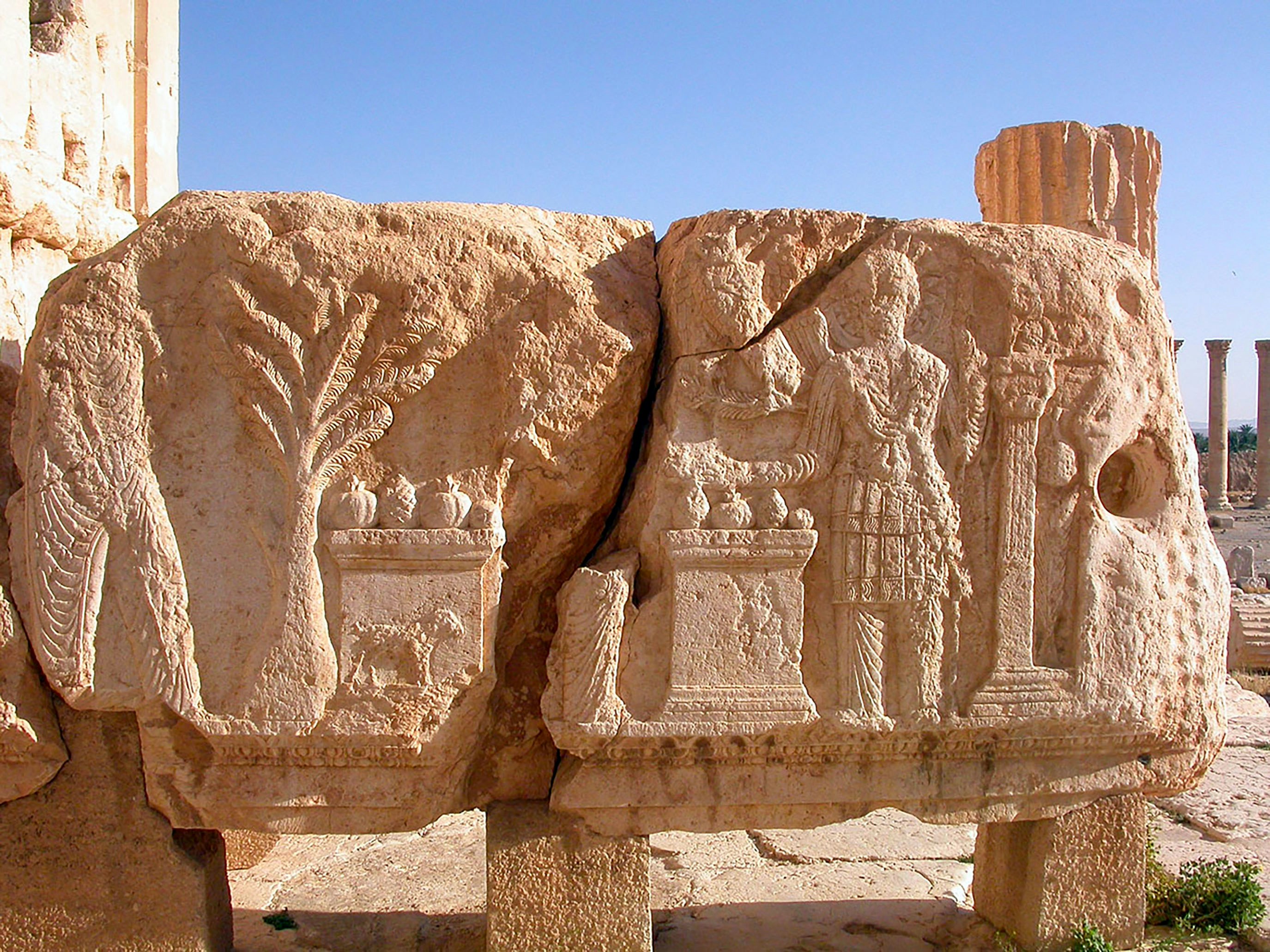 Carved Rite: Ancient Relief of a Warrior and Offerings
