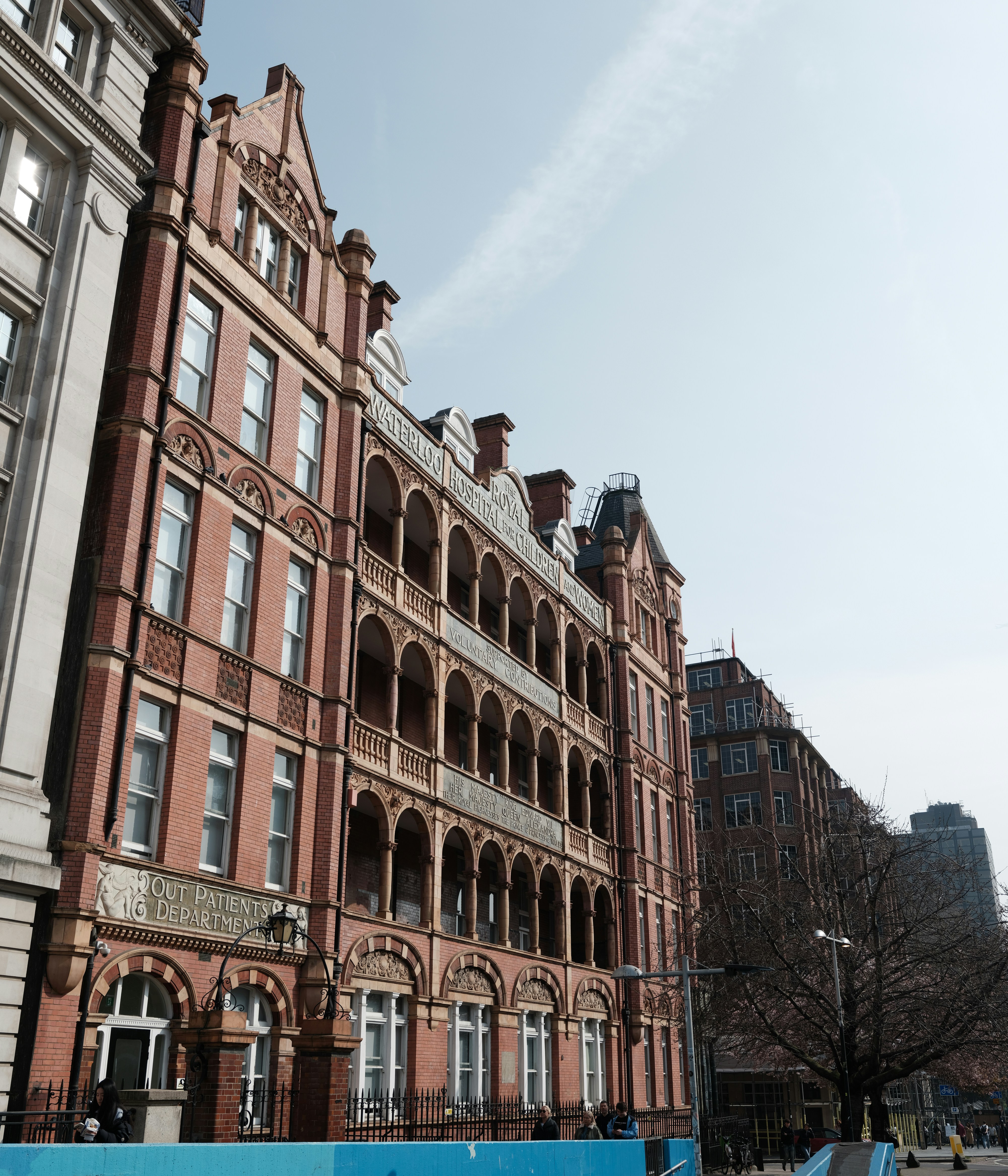 Brick Facade Across Time: Arched Windows and City Street