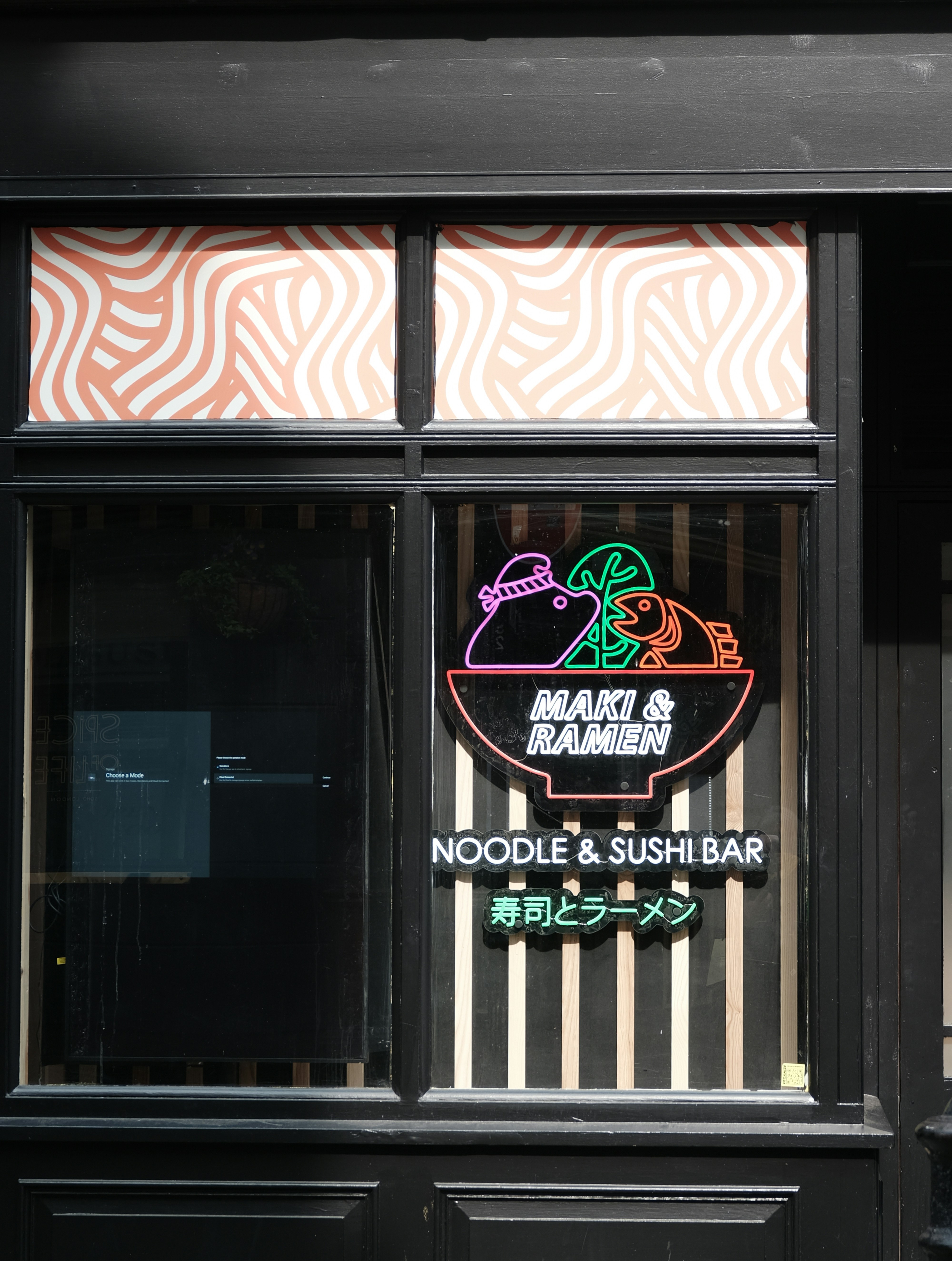 Neon Signage in Glass Panel: Noodle & Sushi Bar Framed by Dark Window