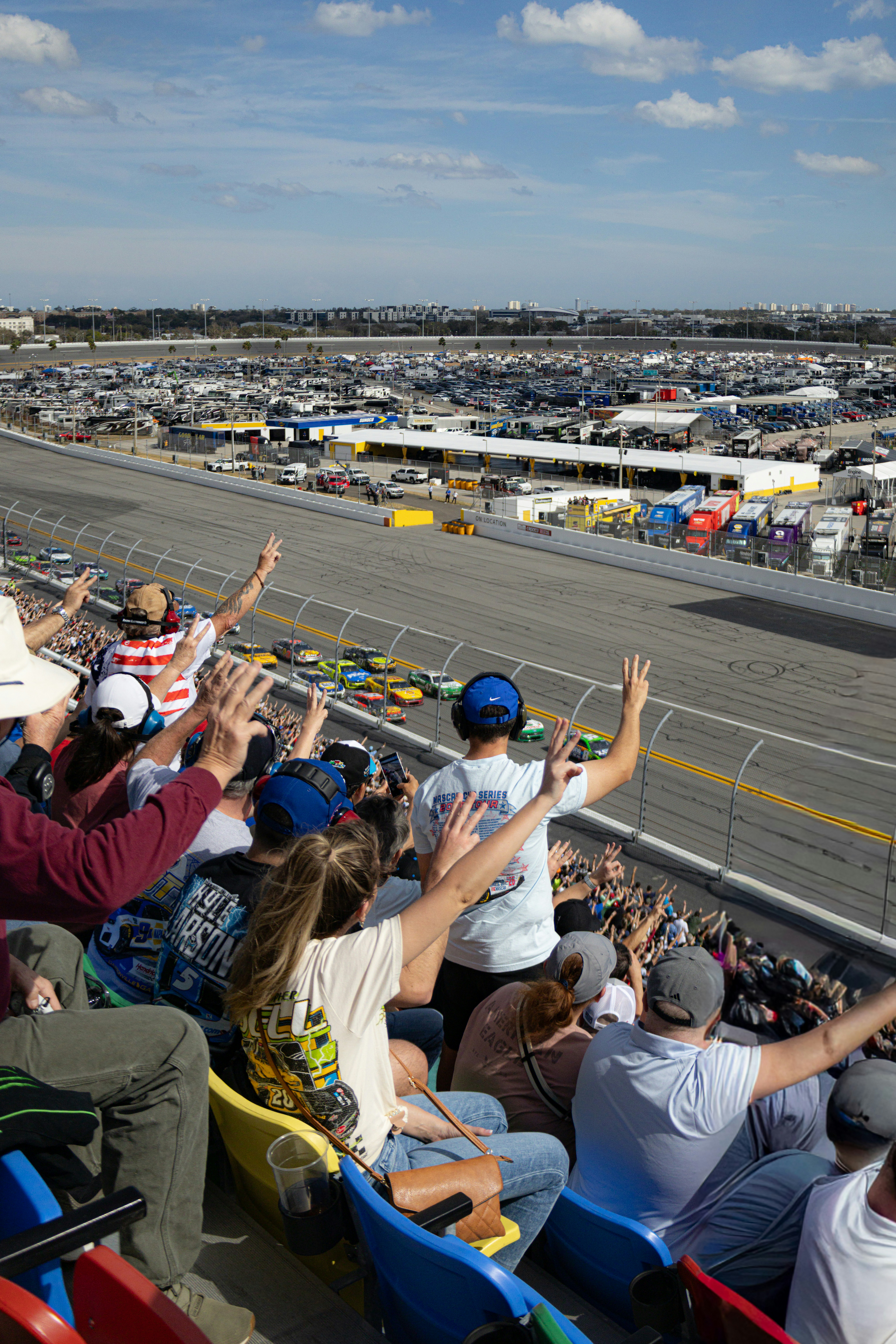 Cheering the Grandstand: A Packed Paddock of Fans at Race Weekend