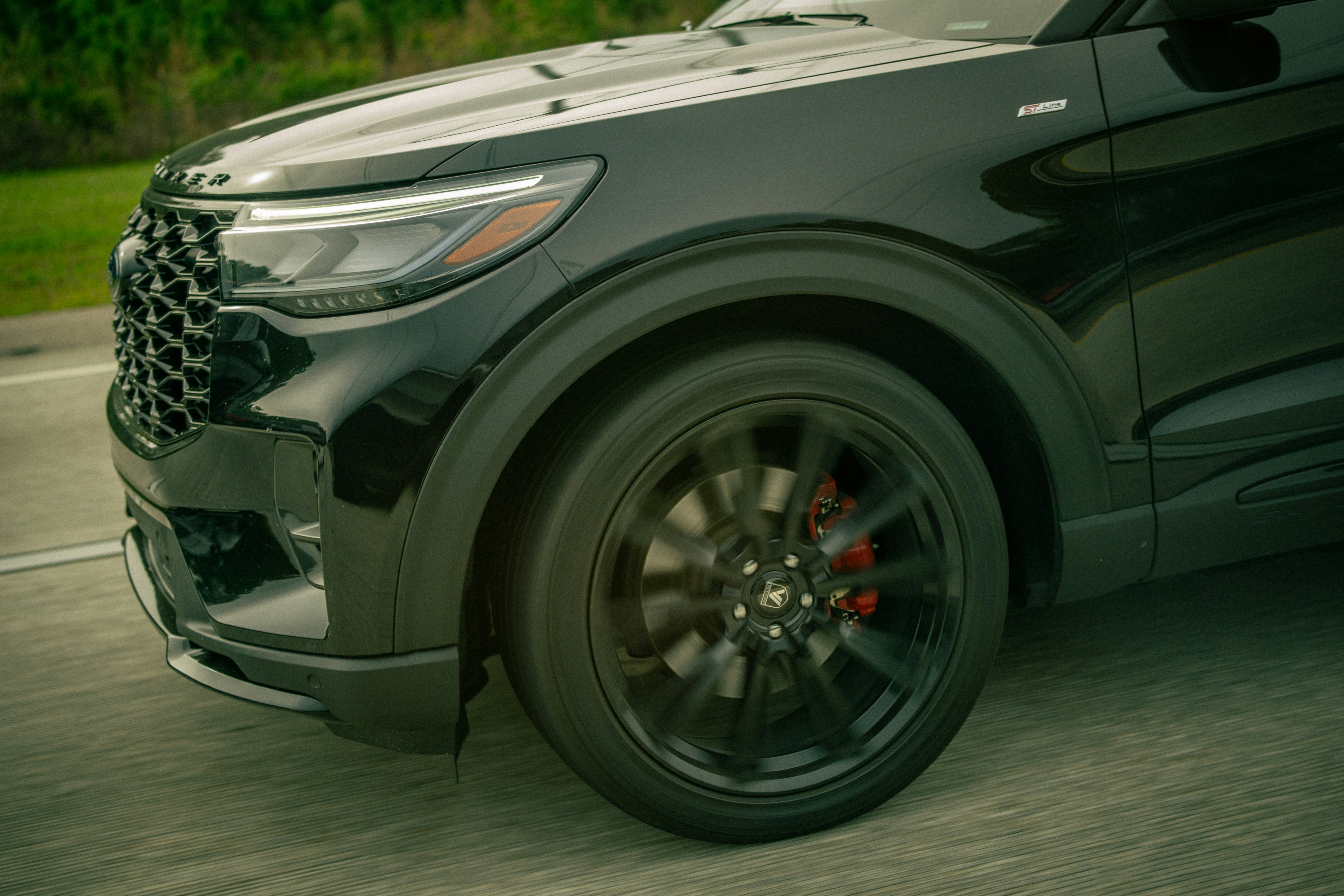 Velocity in Focus: Front-Wheel Power of the Black SUV