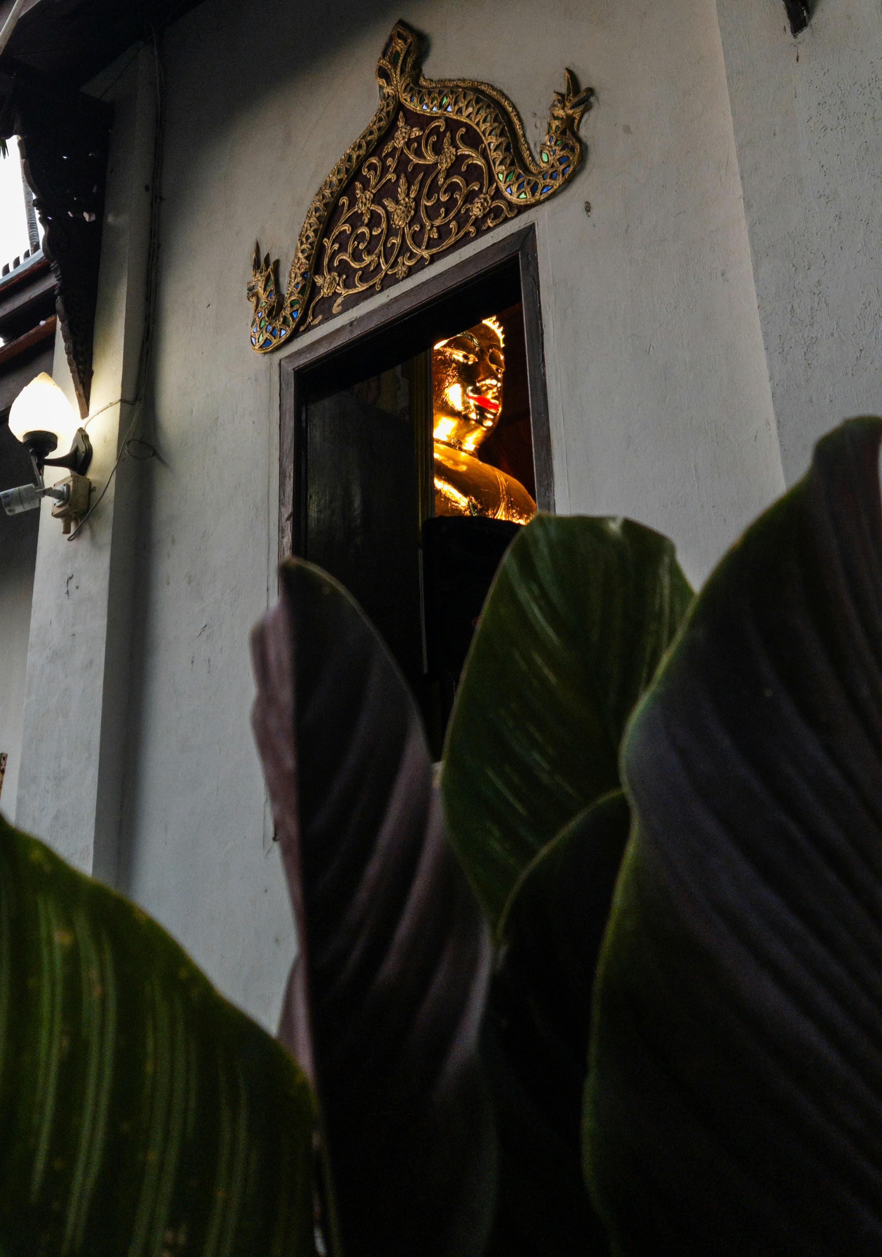 Hidden Shrine: A Gilded Face Peers from the Window