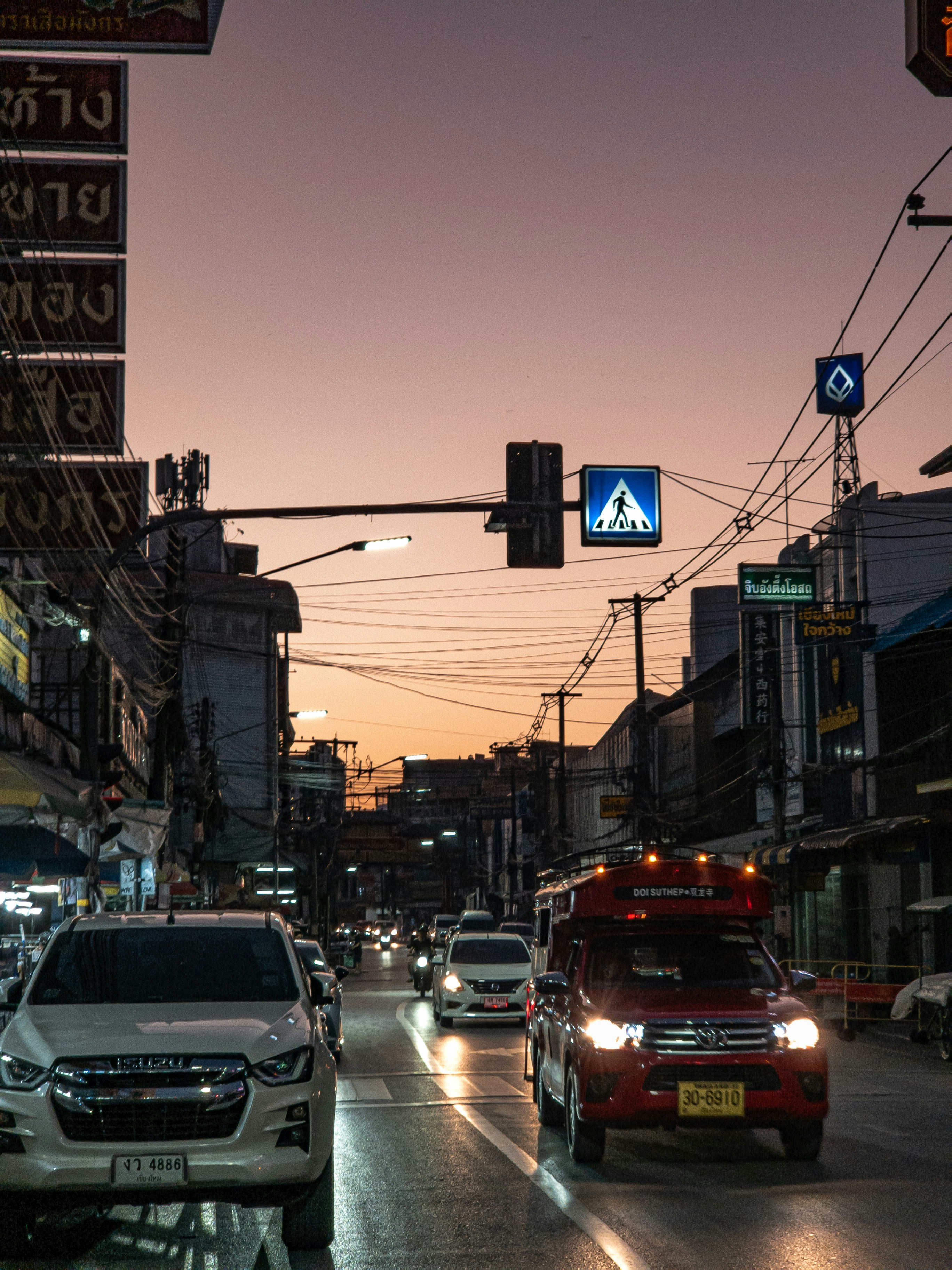 Urban Sunset Rush: Street with Moving Traffic under Dusk Sky