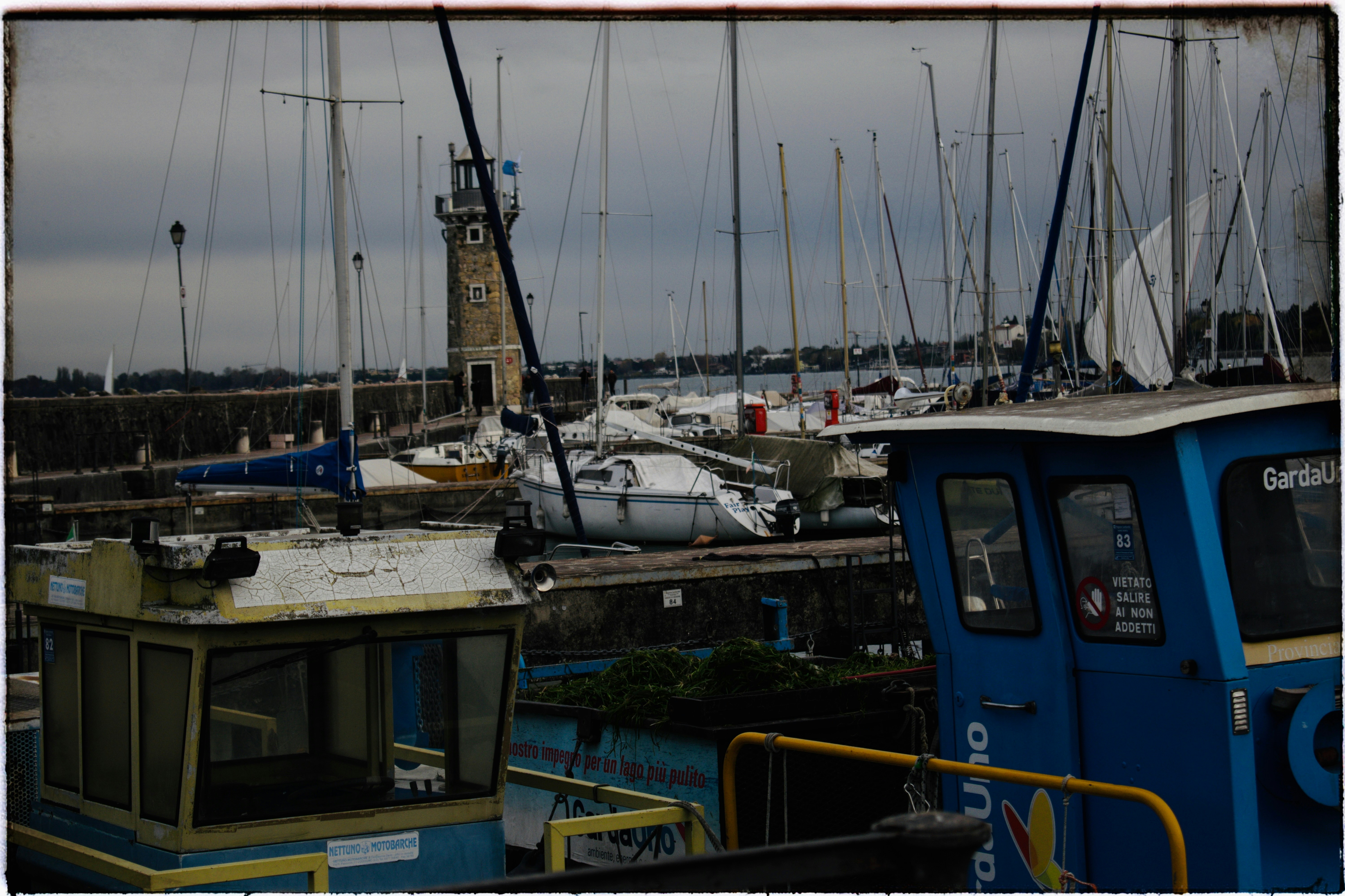 Harbor Quiet: Boats, Masts, and a Tower Sketch the Dusk