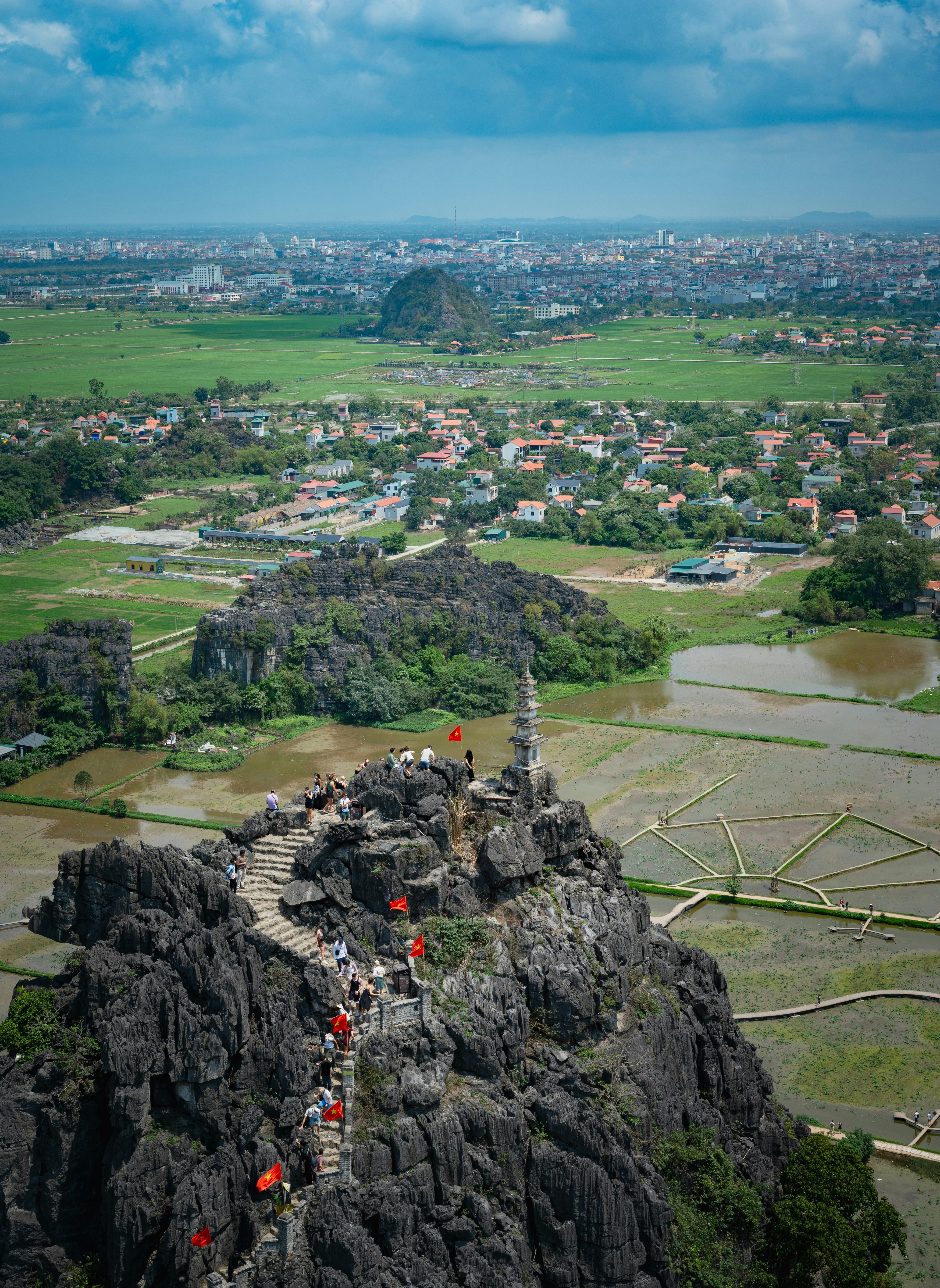 Red Flags Over Humble Spires: Clifftop Path on a Volcanic Needle