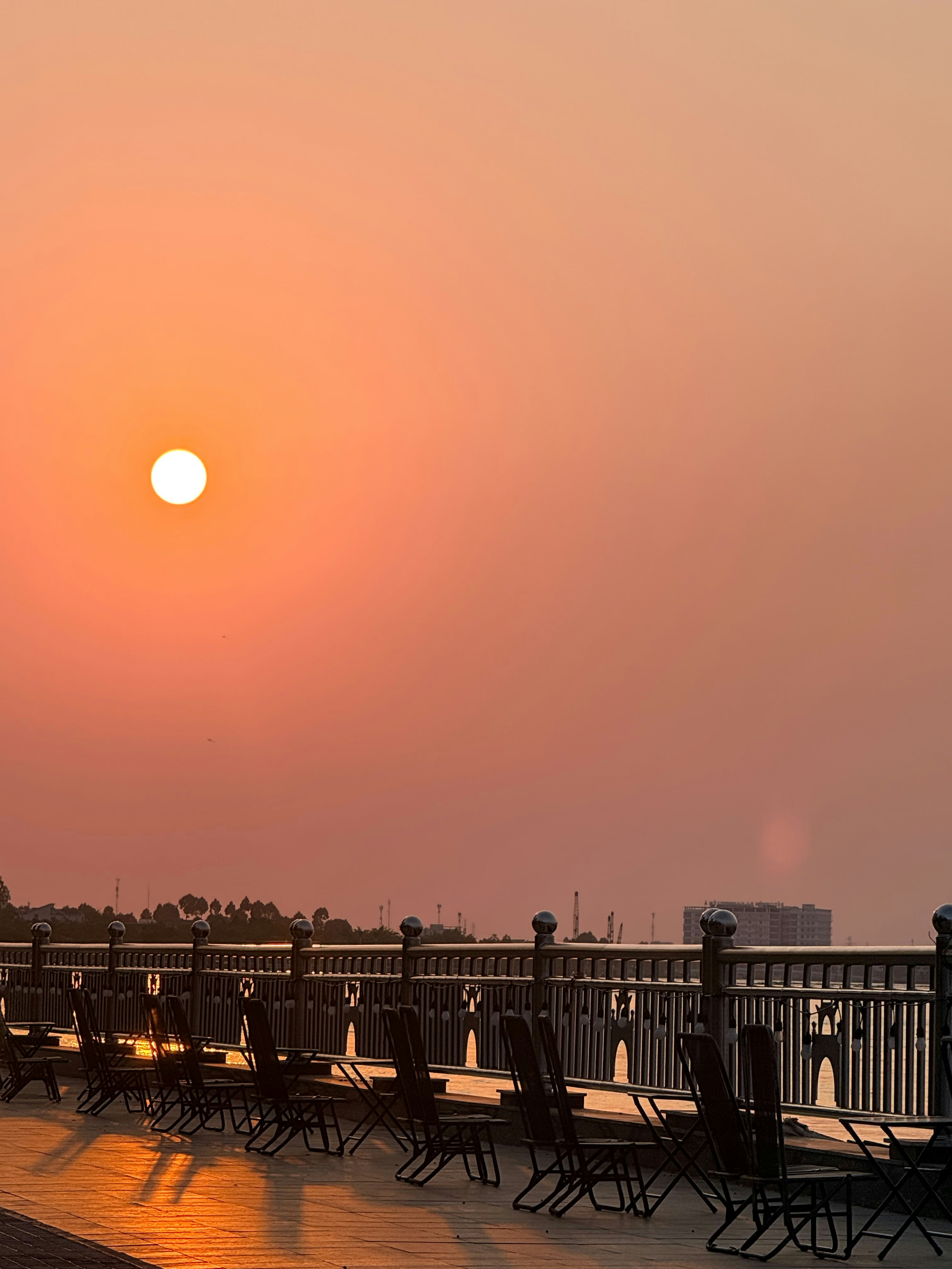 Sunset Terrace: Silent Rows by the Waterfront