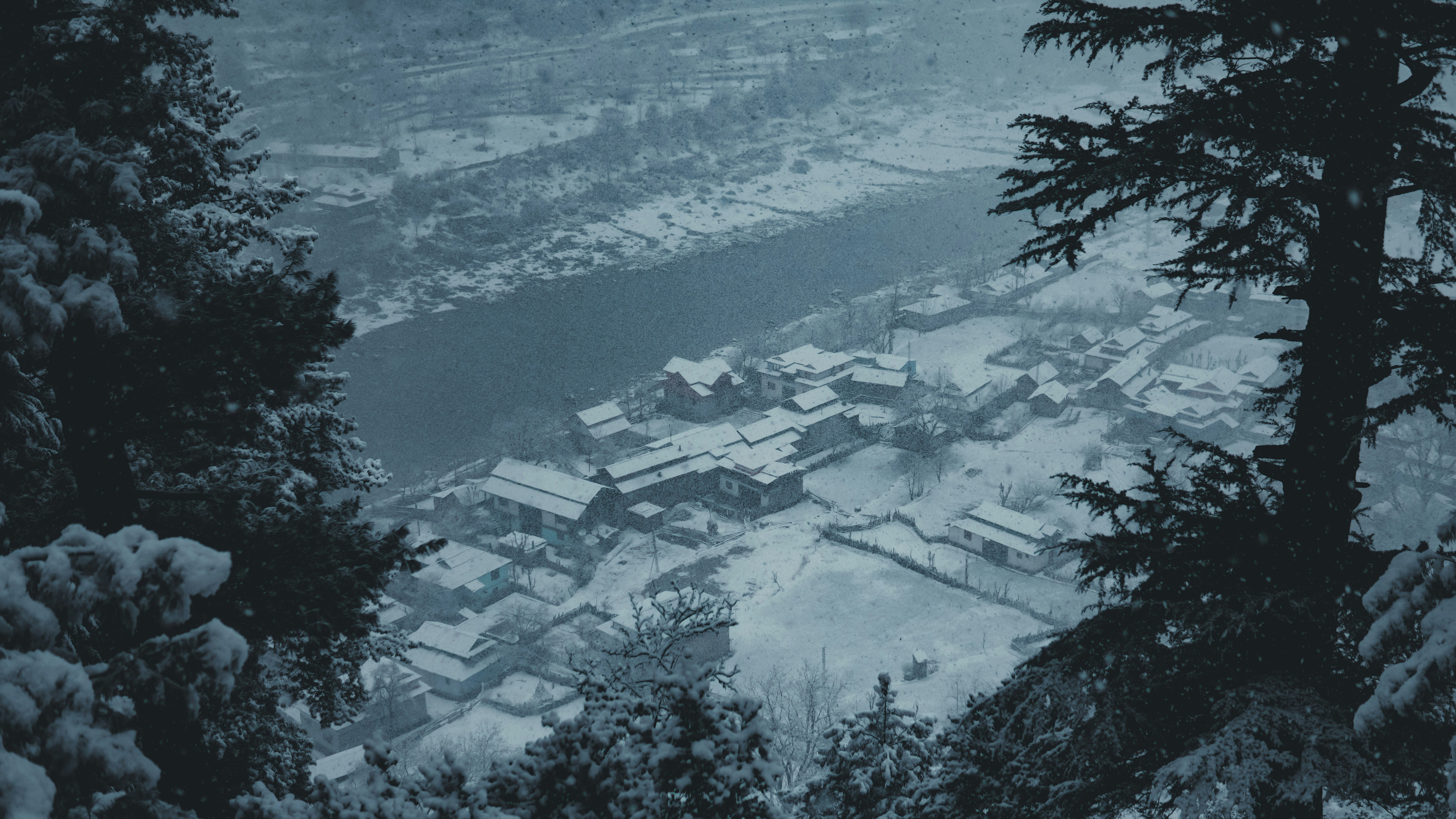 Snowbound Village Framed by Pine silhouettes