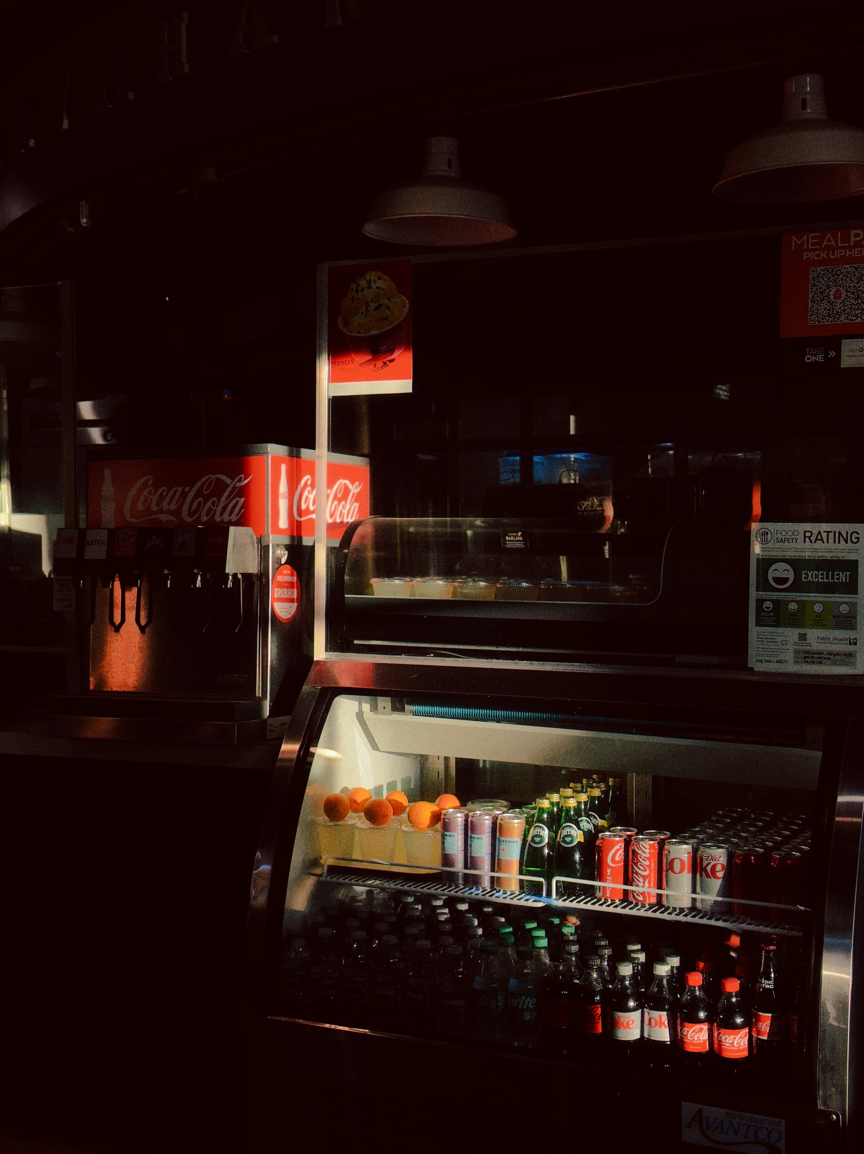 Dim Corner Café: Coke Fridge Light in a Low-Key Convenience Store