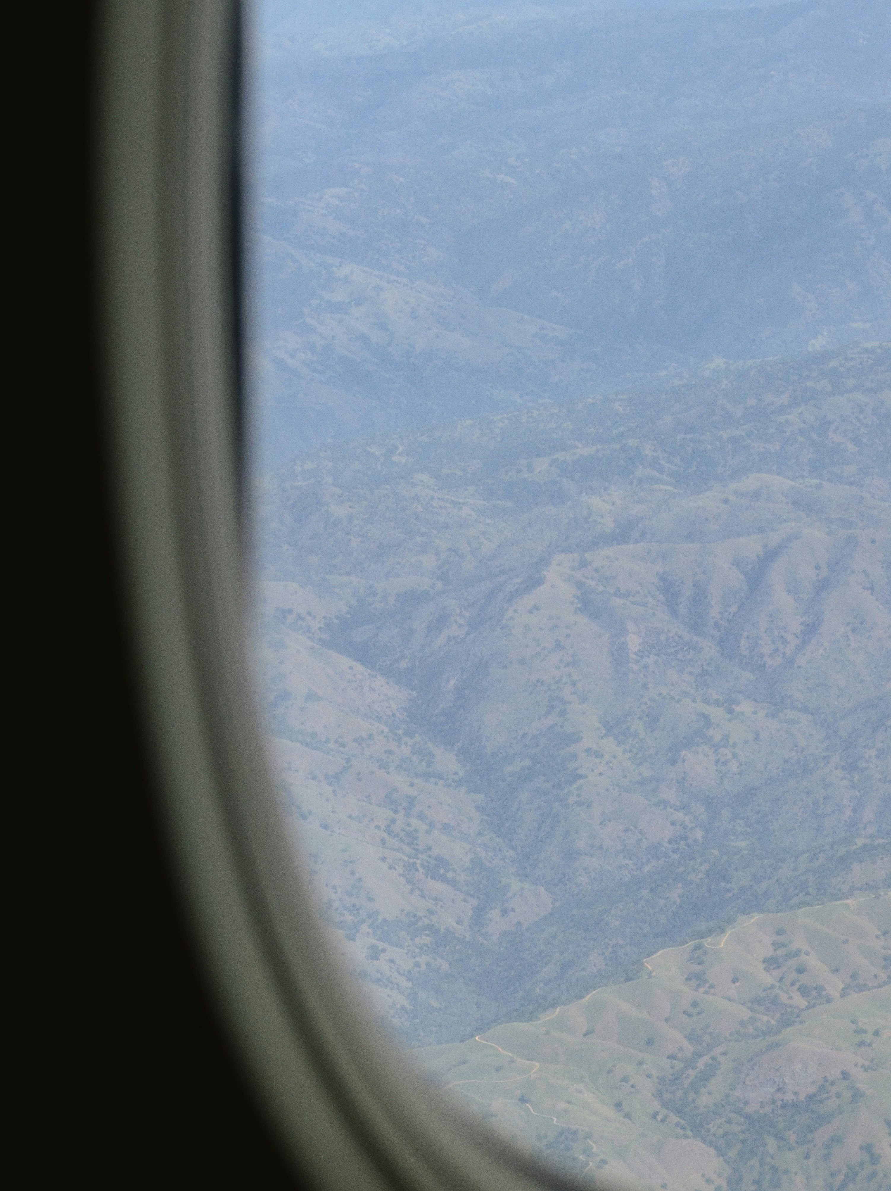 Window View: Alpine Valleys Skirt the Horizon