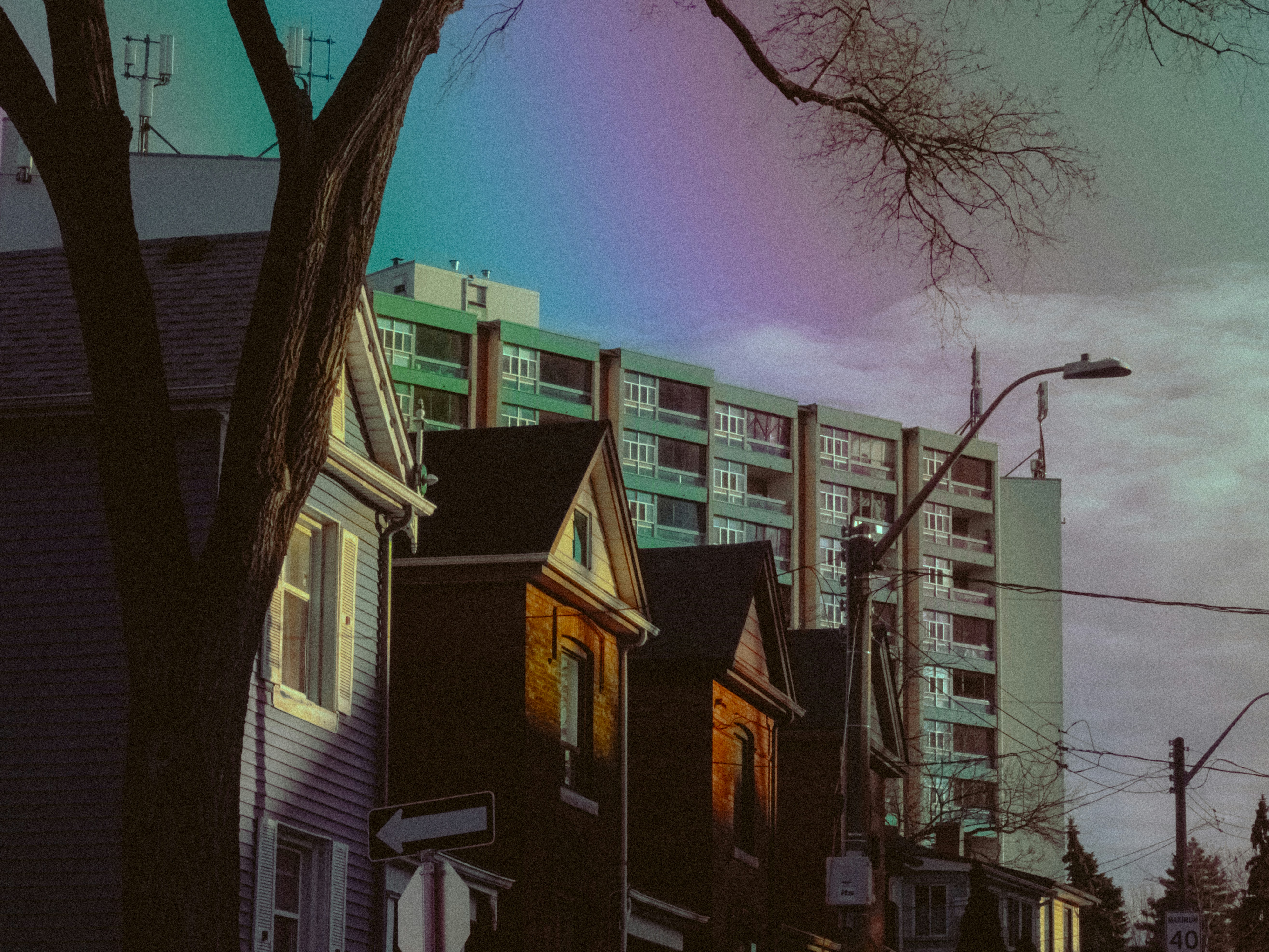 Rainbow over a Quiet Street: A City Block in Twilight Hue