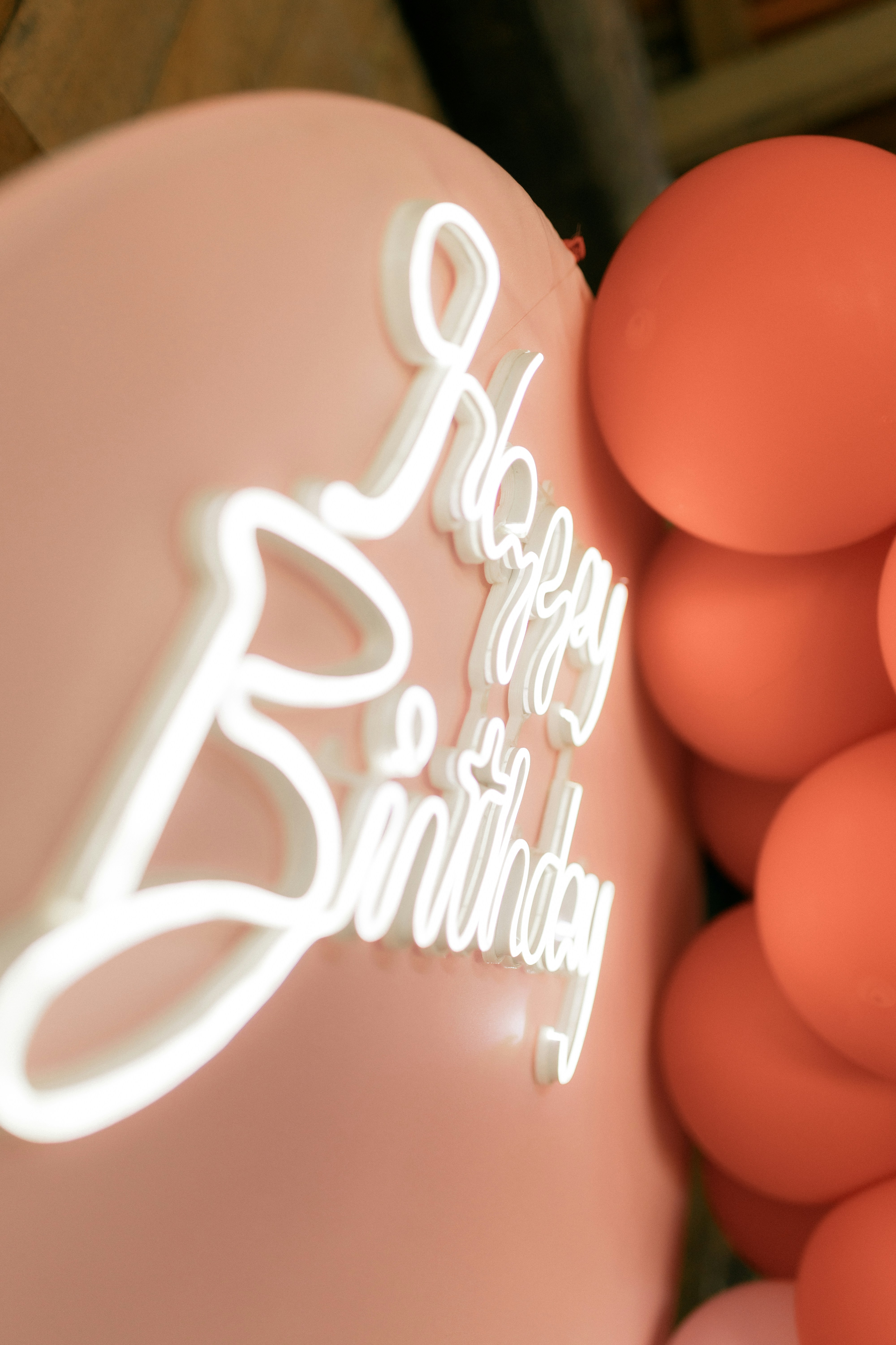Glow of a Birthday Neon Against Peach Bubbles