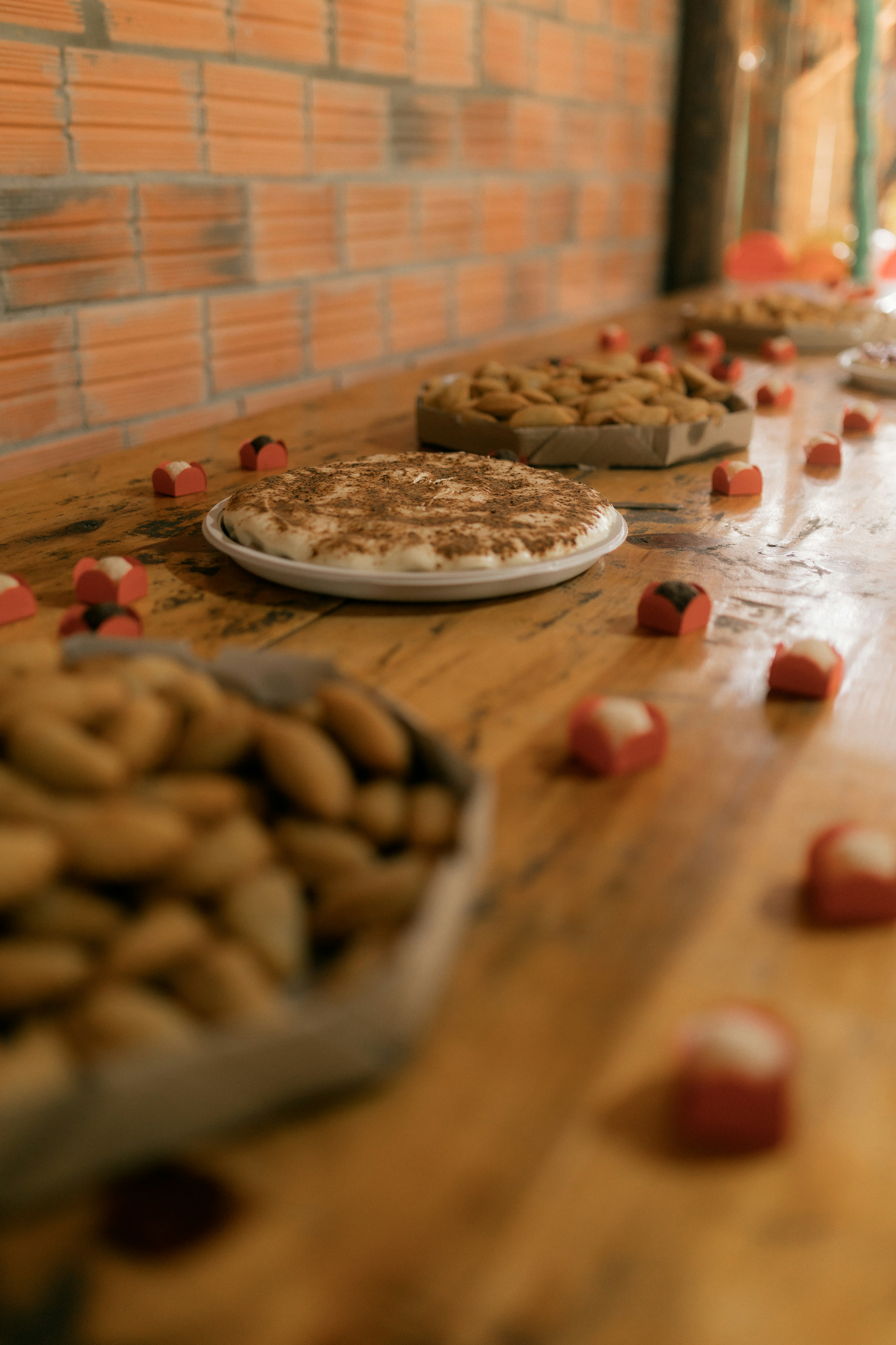 Crème-topped pastry centerpiece on a rustic wooden bar