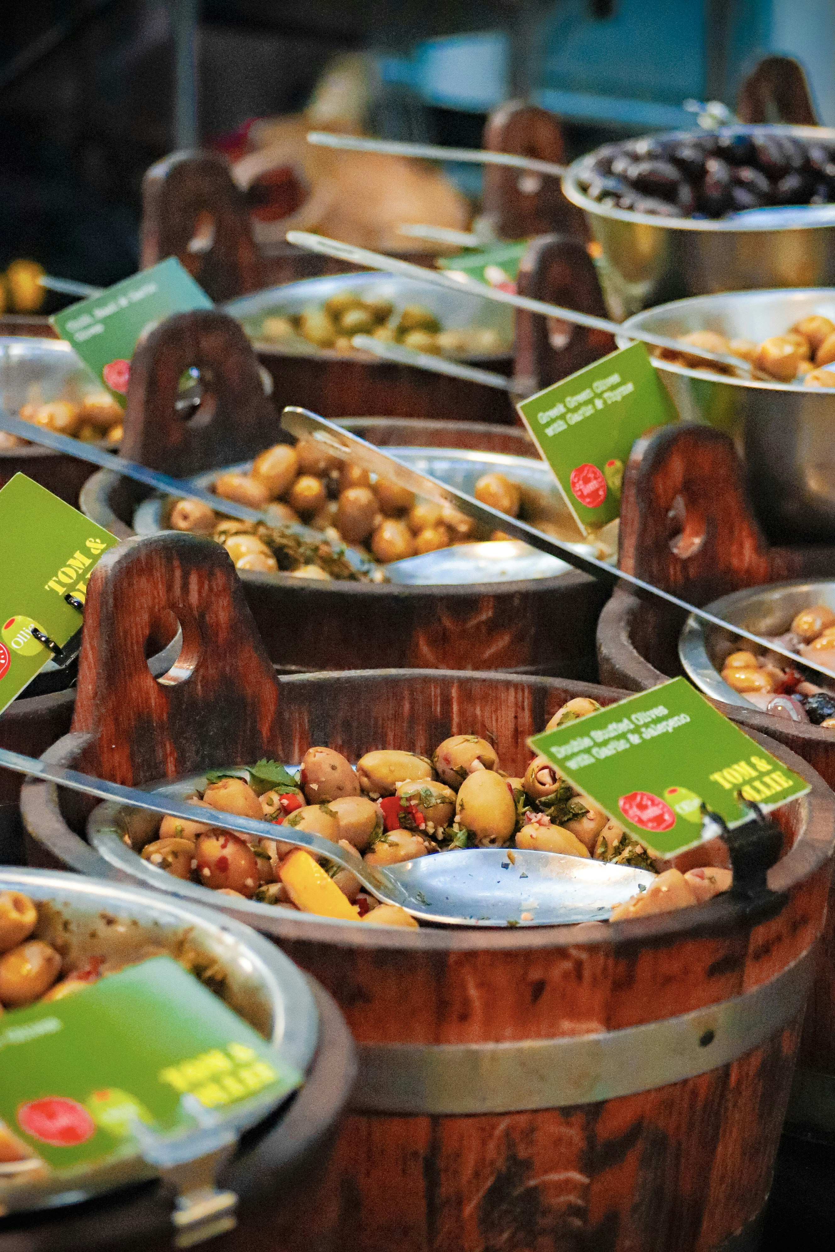 Carry-On Crunch: A Market Barrel Display of Olive Garnishes