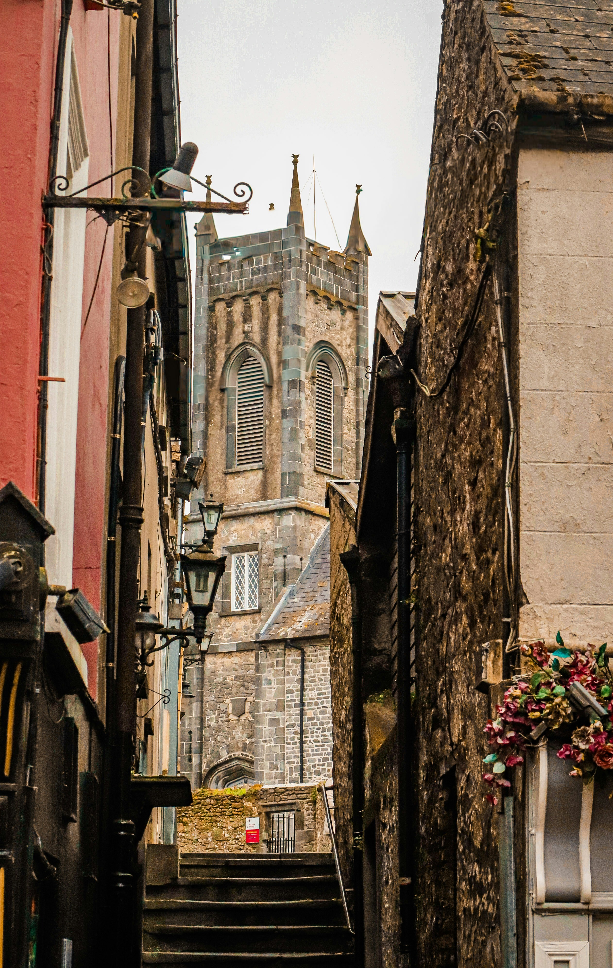 Towering Gothic Quiet: Alleyway Toward the Church