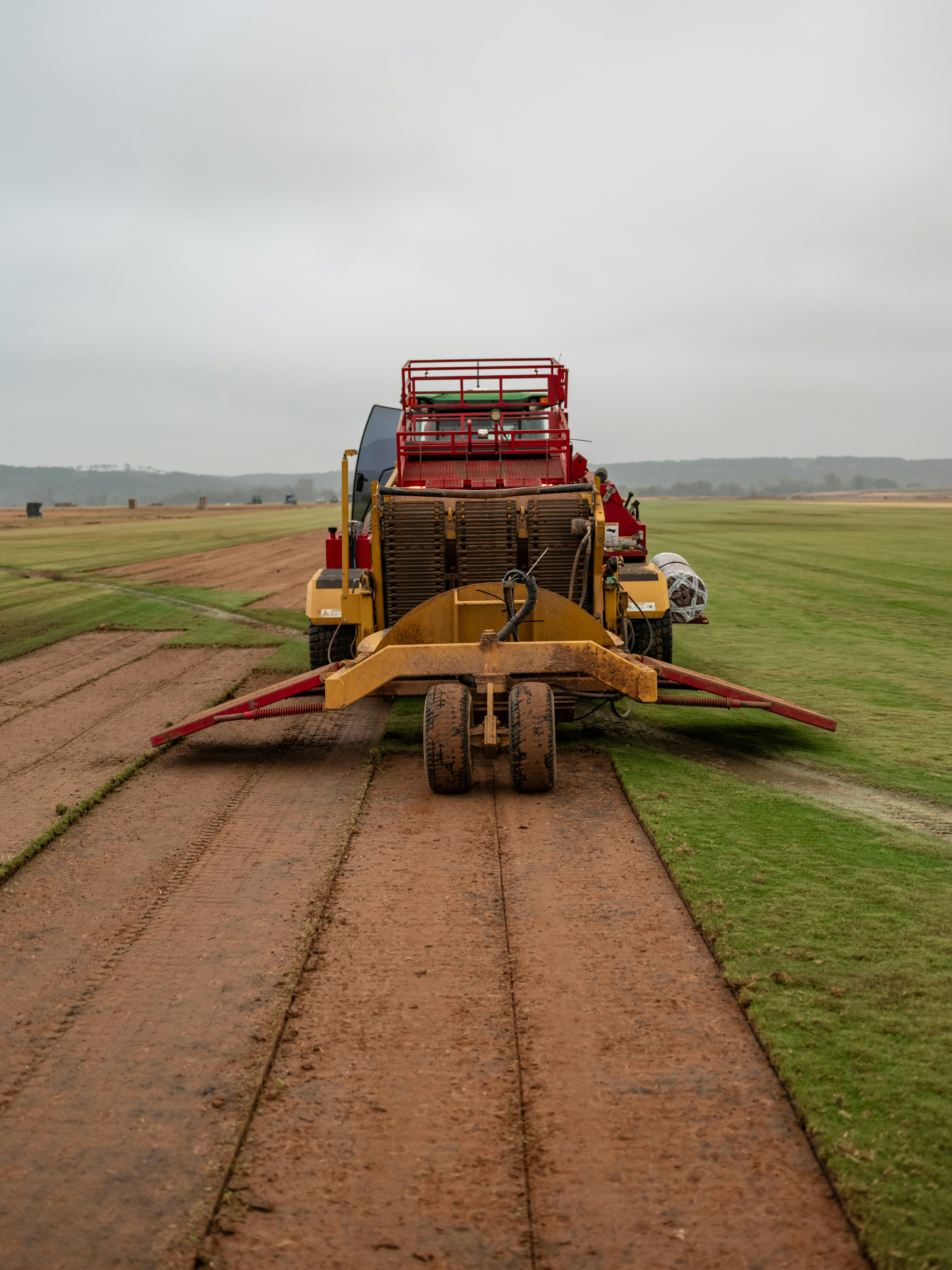 Turf harvesting machine cutting grass on a field photo – Free ...
